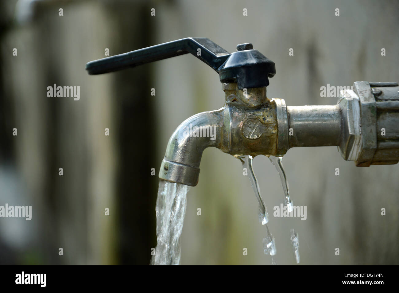 the flowing water on tap Stock Photo - Alamy