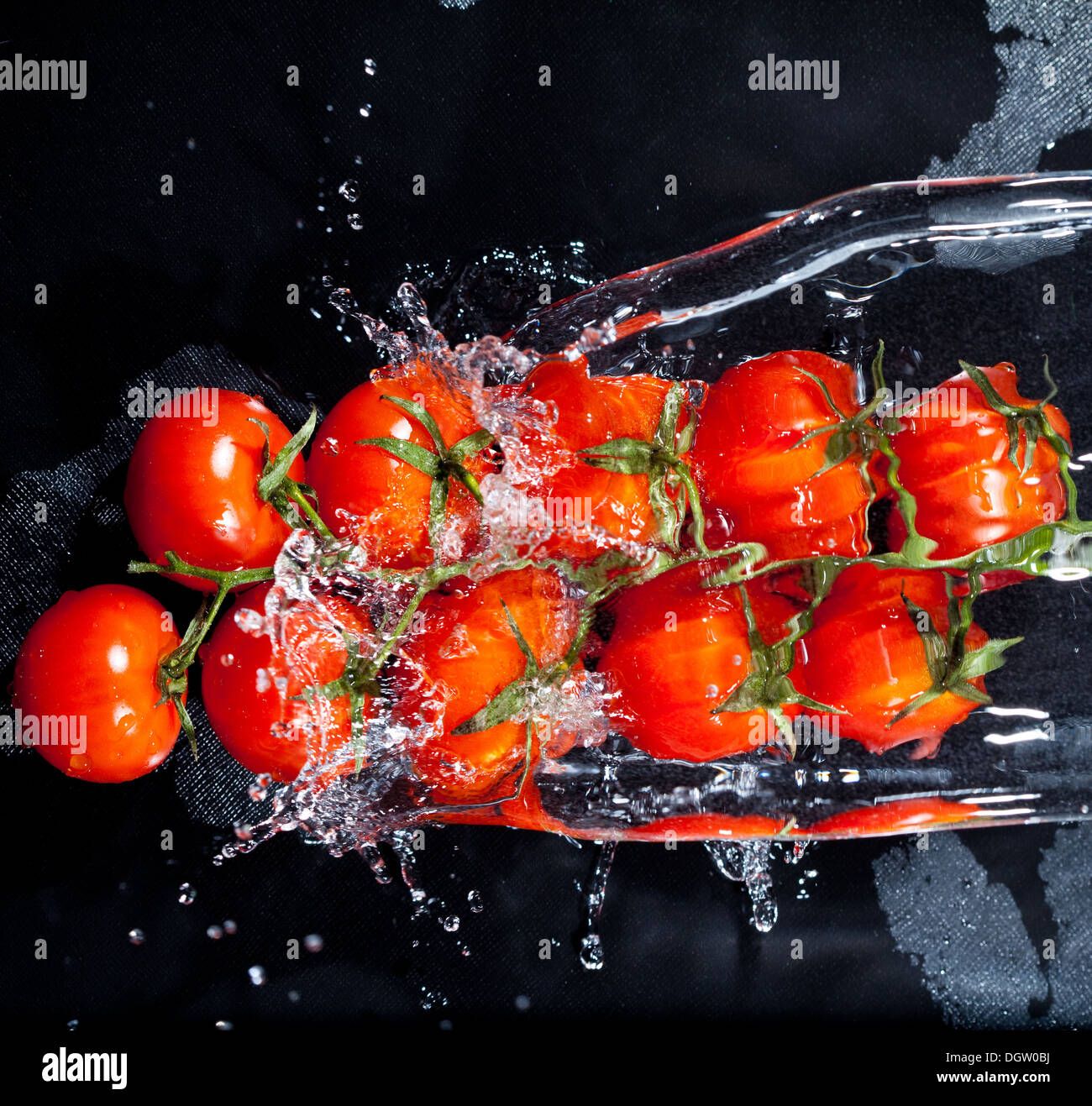 Tomato in water splashes Stock Photo - Alamy
