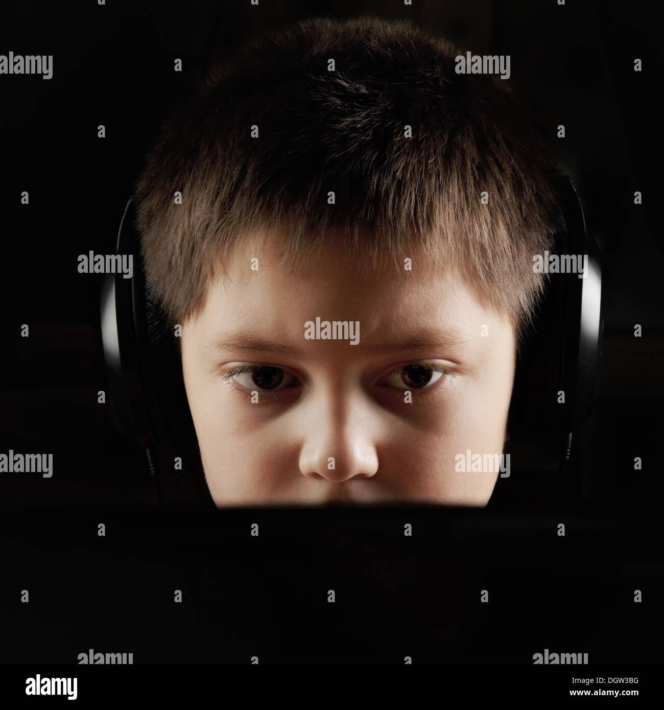 Child behind laptop hi-res stock photography and images - Alamy