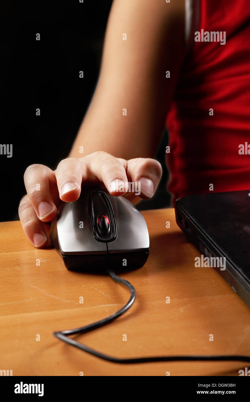 Boy hand on computer mouse Stock Photo - Alamy