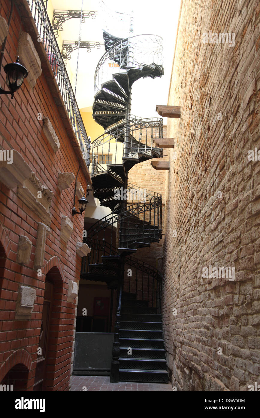 A spiral staircase between houses Stock Photo - Alamy