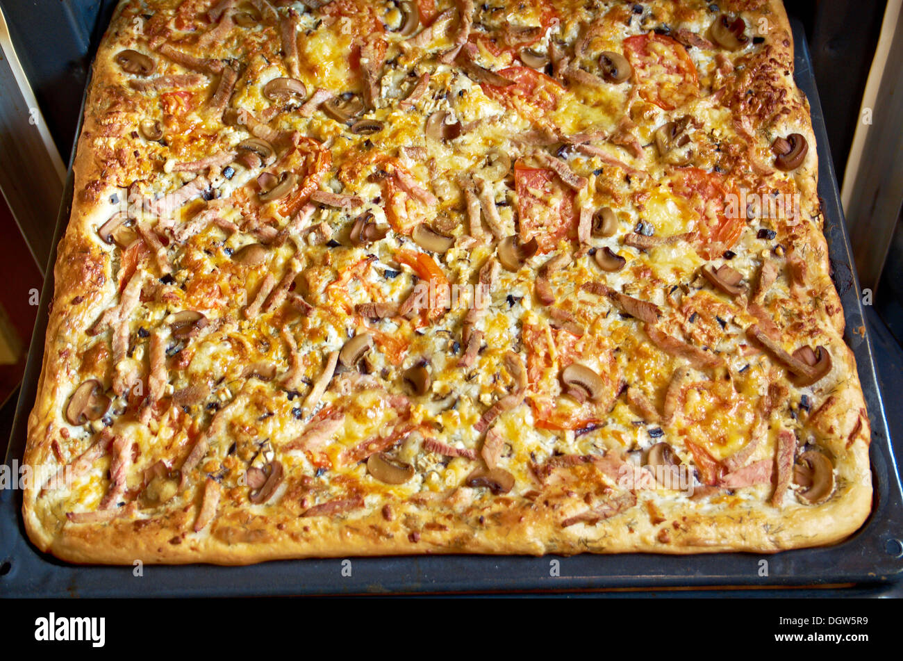 Large Rectangular pizza with meat Stock Photo - Alamy