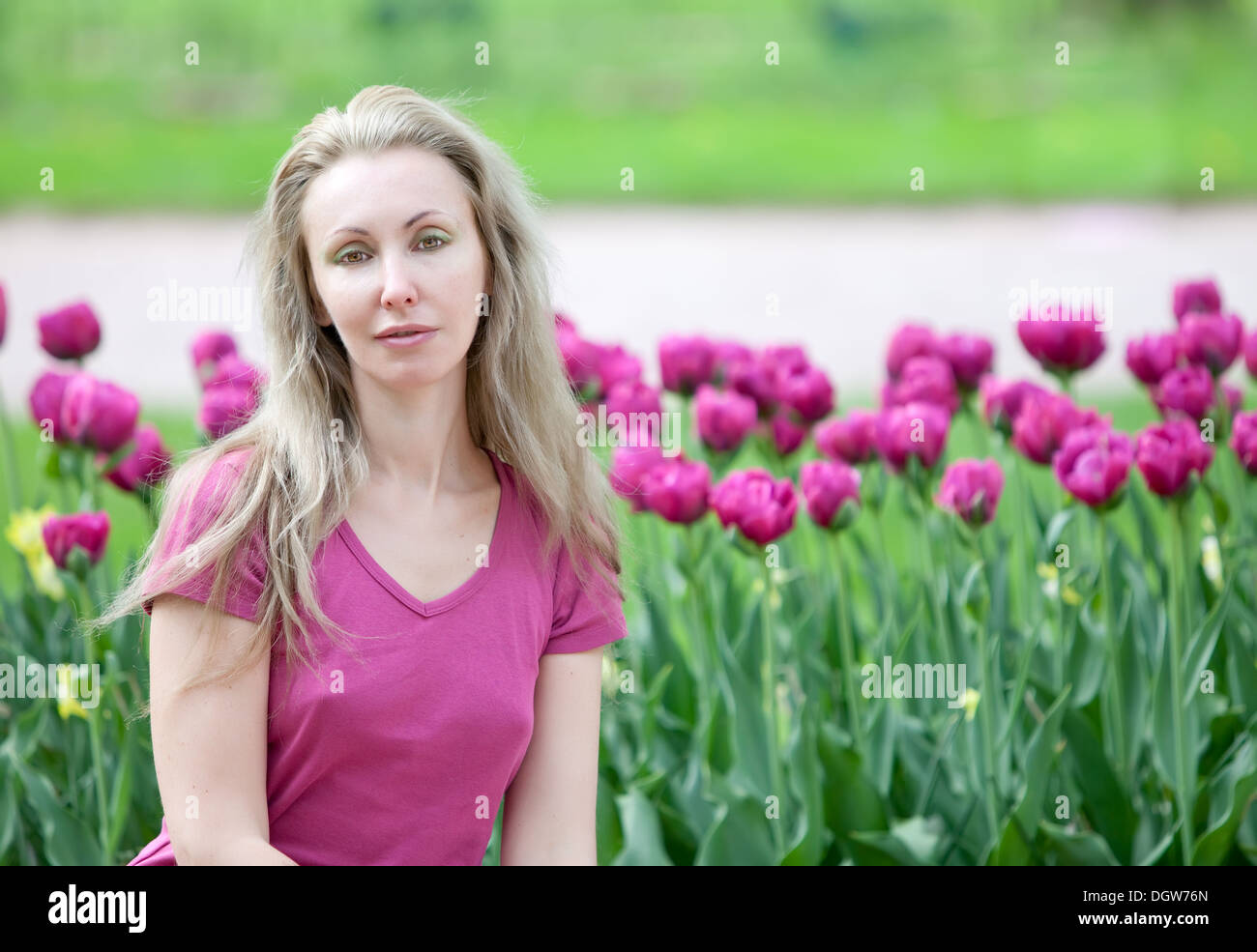 Beautiful woman in spring park hi-res stock photography and images - Alamy
