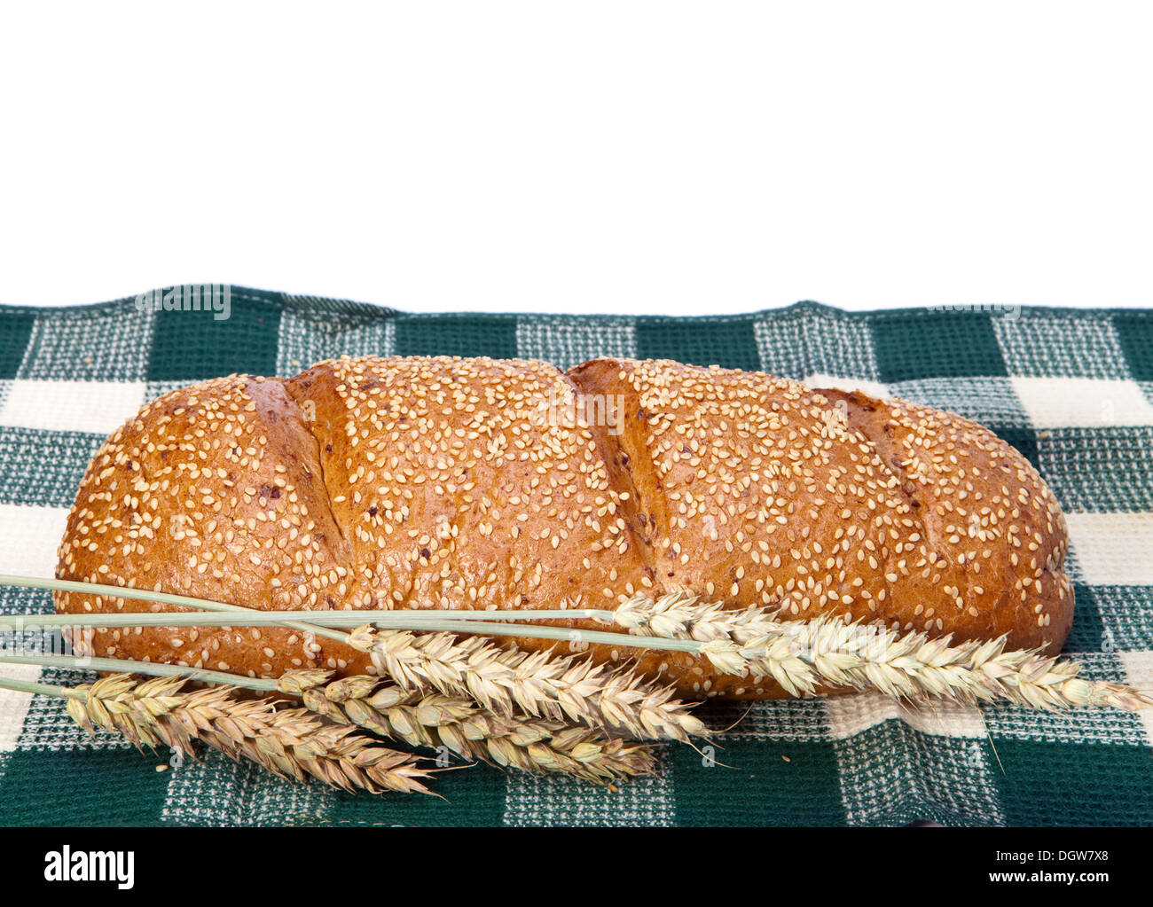 Wheat and bread on white background Stock Photo - Alamy