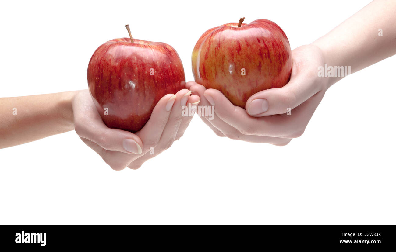 Two hands give each other an apple Stock Photo - Alamy