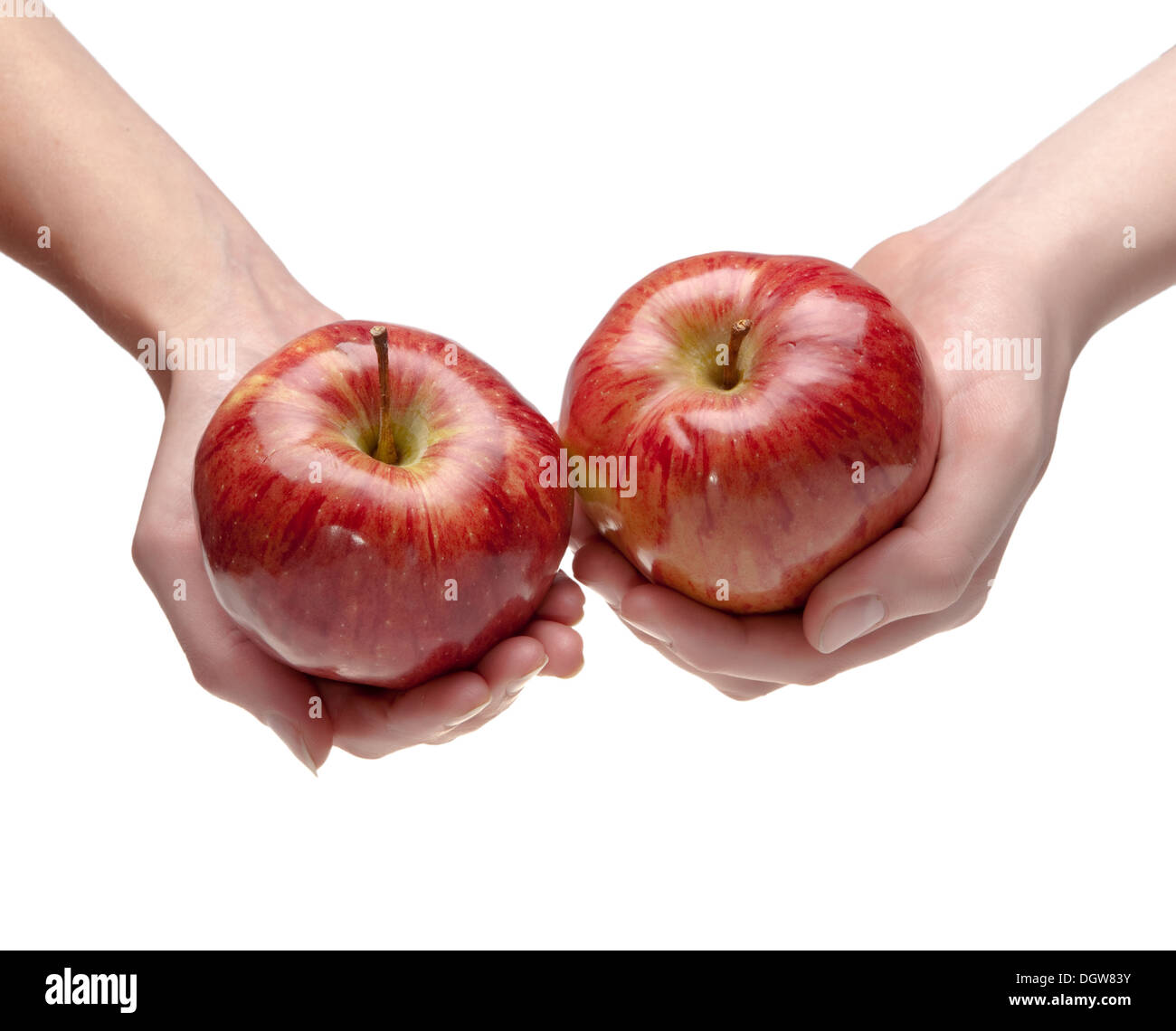 Two hands give each other an apple Stock Photo - Alamy