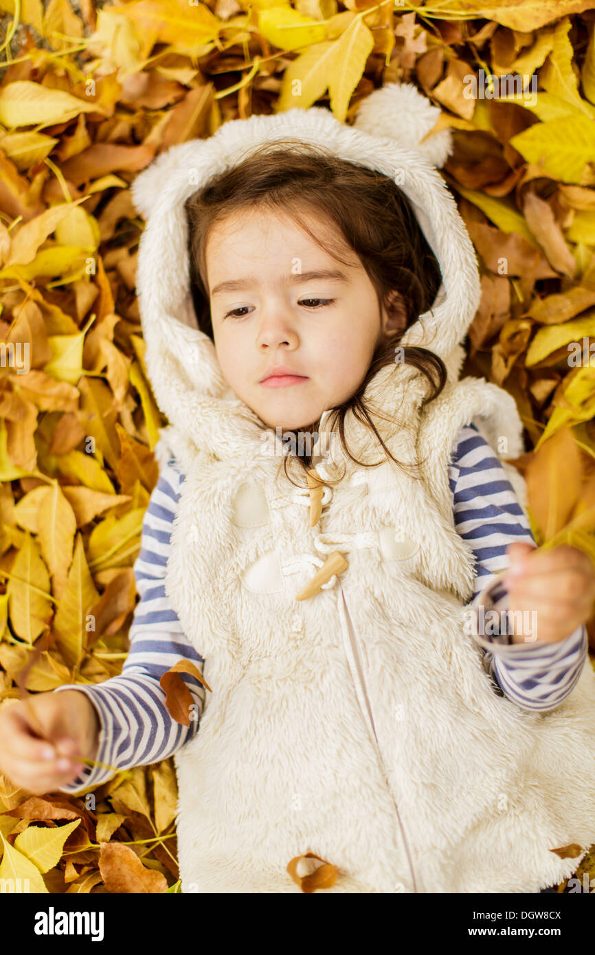 Little girl at the autumn leaves Stock Photo - Alamy