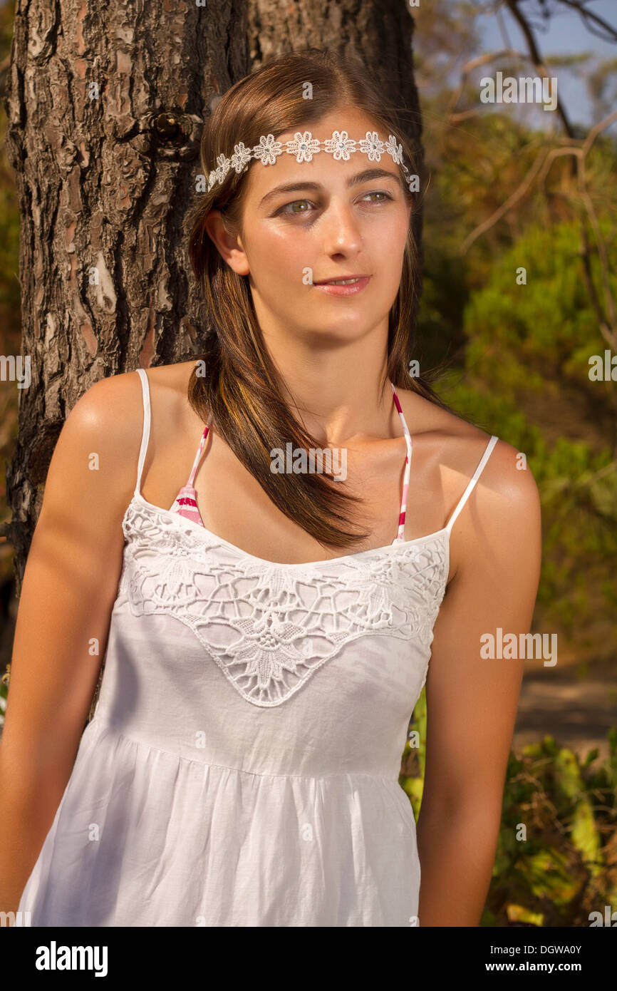 View of a beautiful young girl with a long white dress on the forest ... View of a beautiful young girl with a long white dress on the forest ...