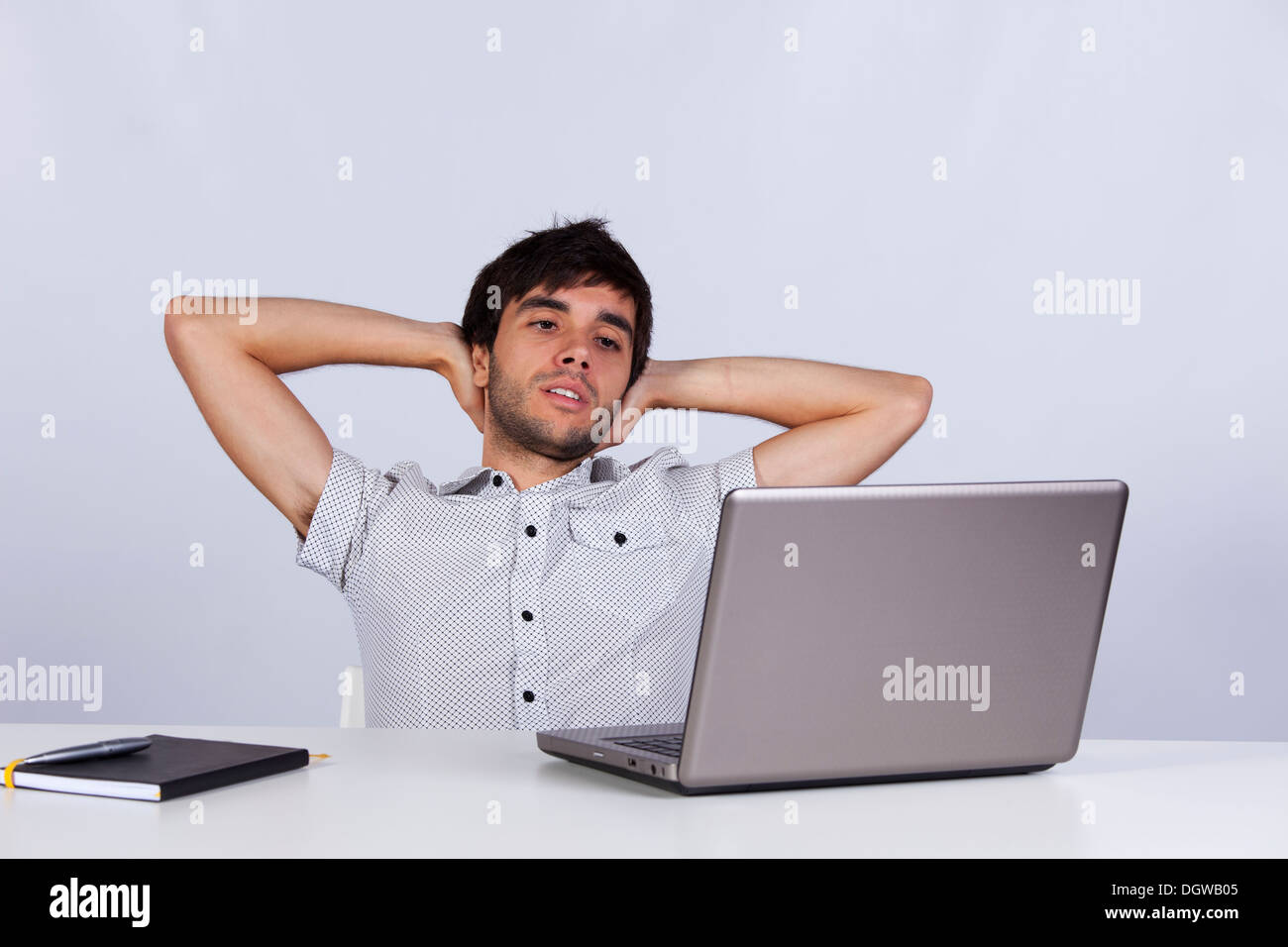 Businessman taking a break at his office Stock Photo - Alamy
