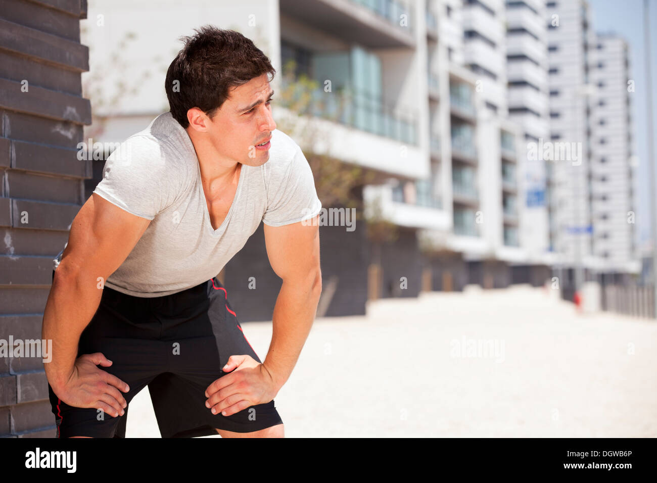 Athlete man tired after a long running sport event in the city Stock ...