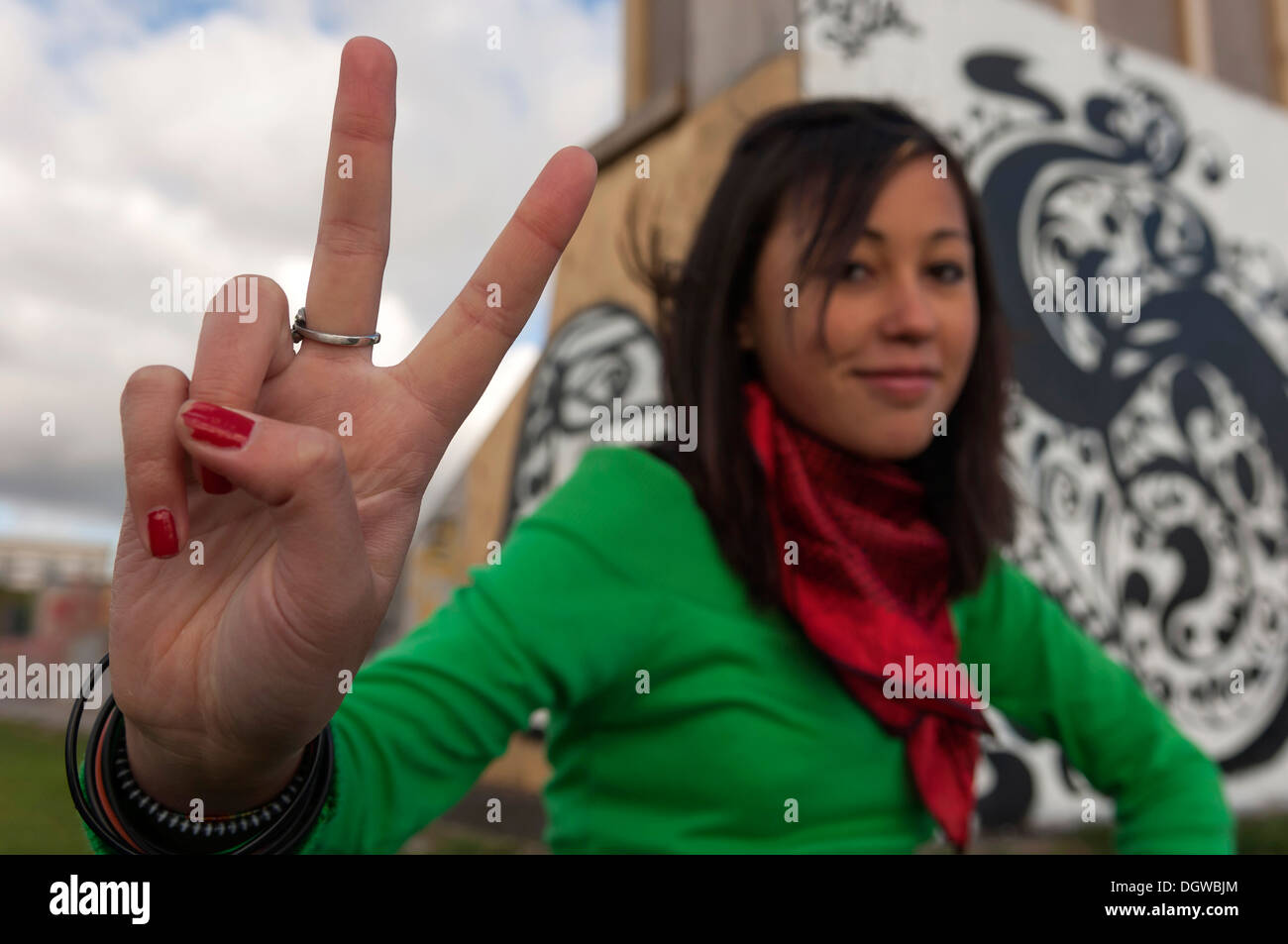 Female teenager giving peace sign hi-res stock photography and images ...