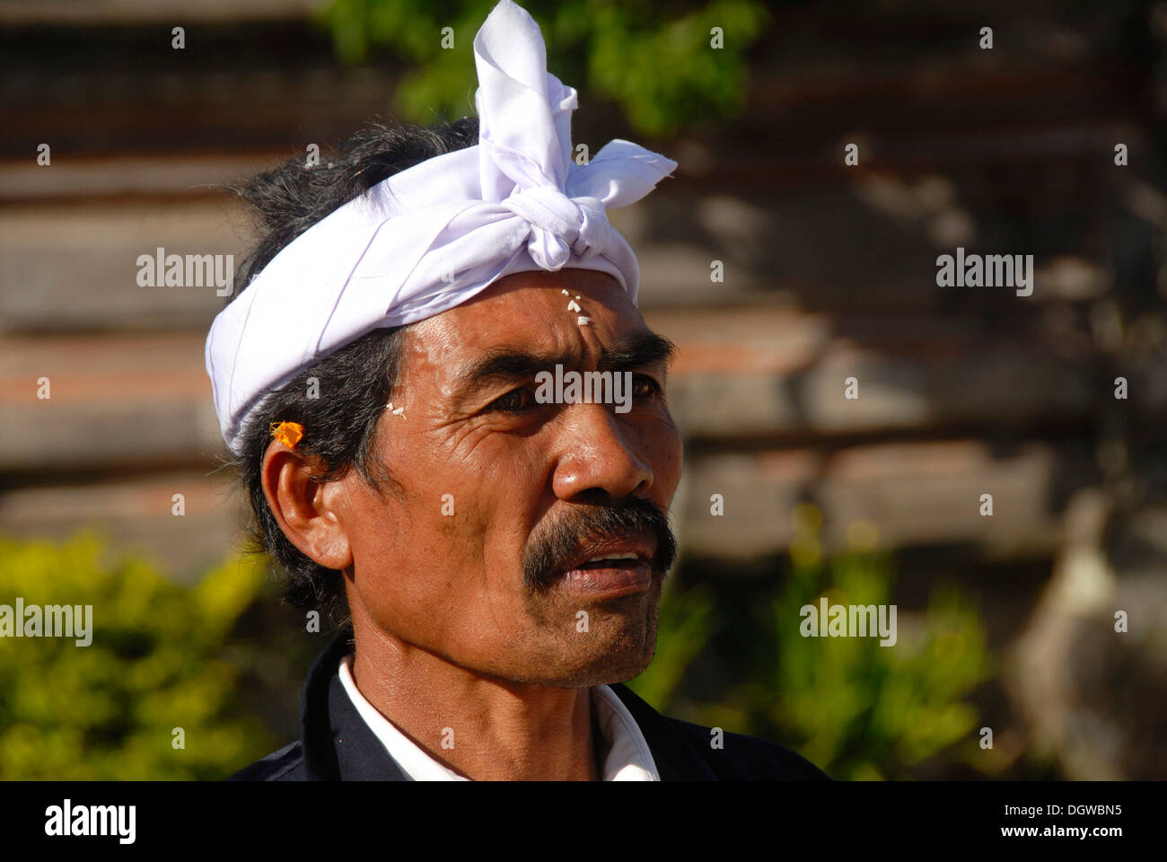 Balinese Hinduism, portrait, devout man with a white headband, Pura ...