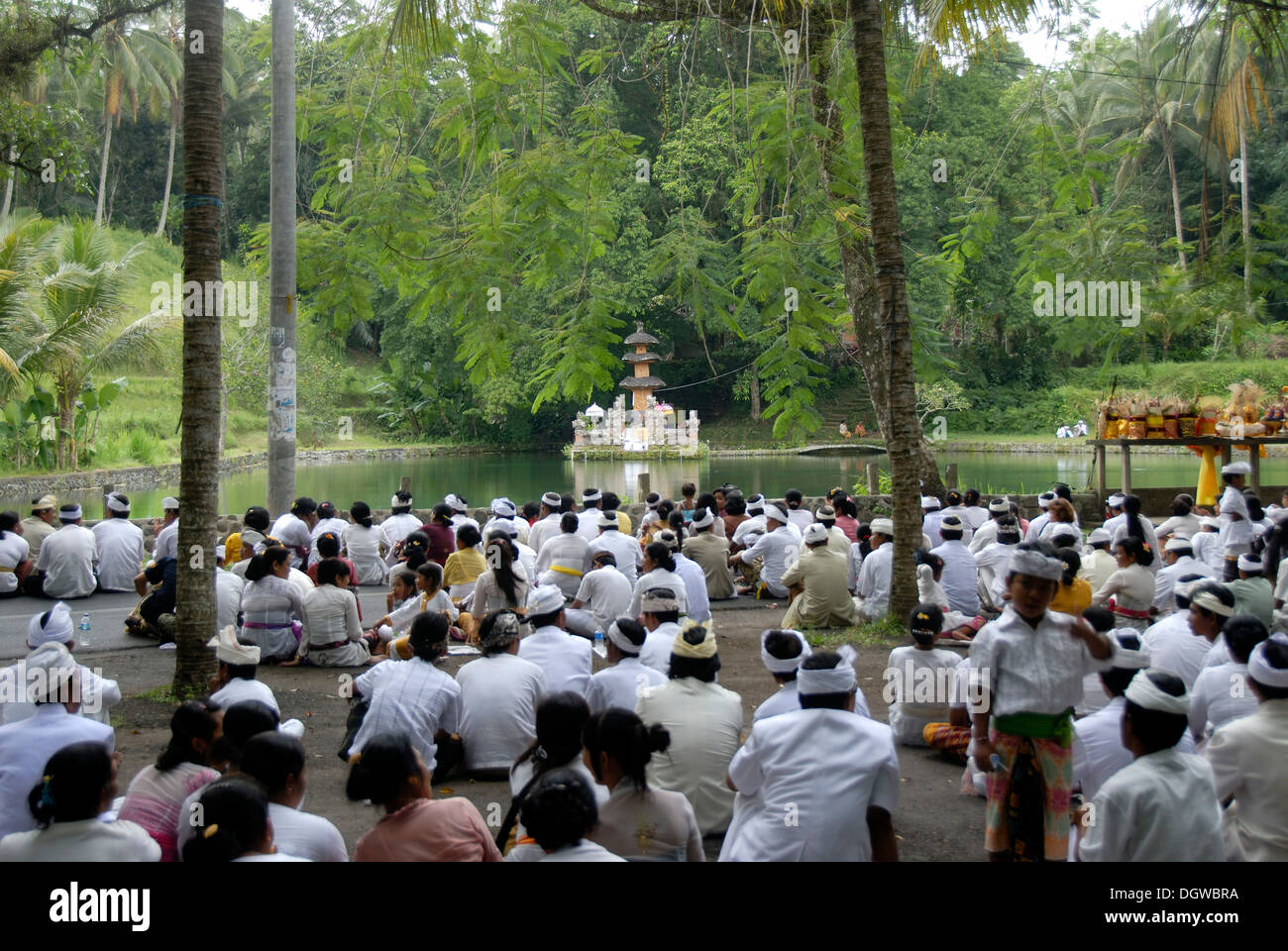 Bali Hinduism, many religious believers meeting in ceremony, sitting on ...