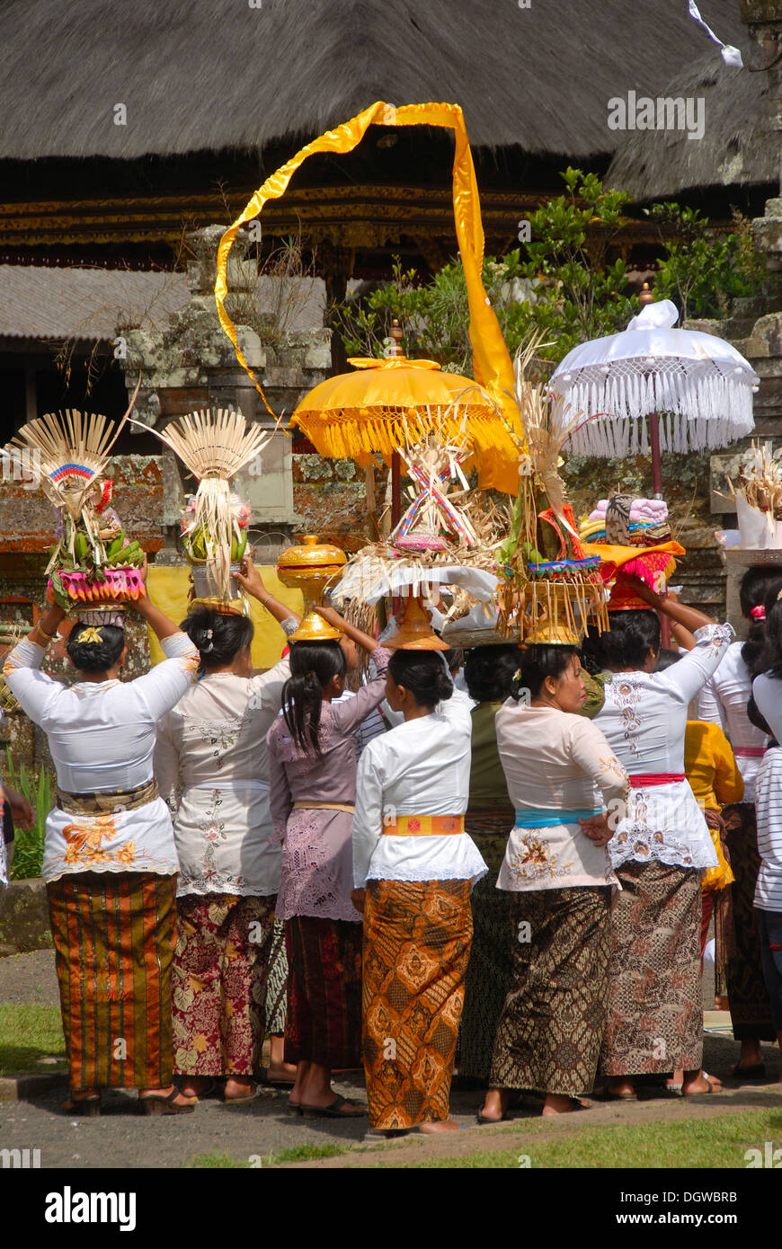 Bali Hinduism, believers, women, dressed in festive clothes carrying ...