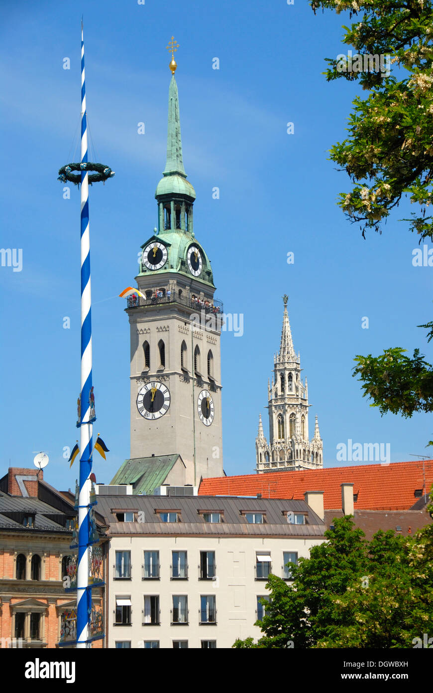 View from Viktualienmarkt square of the maypole and the pointed towers ...