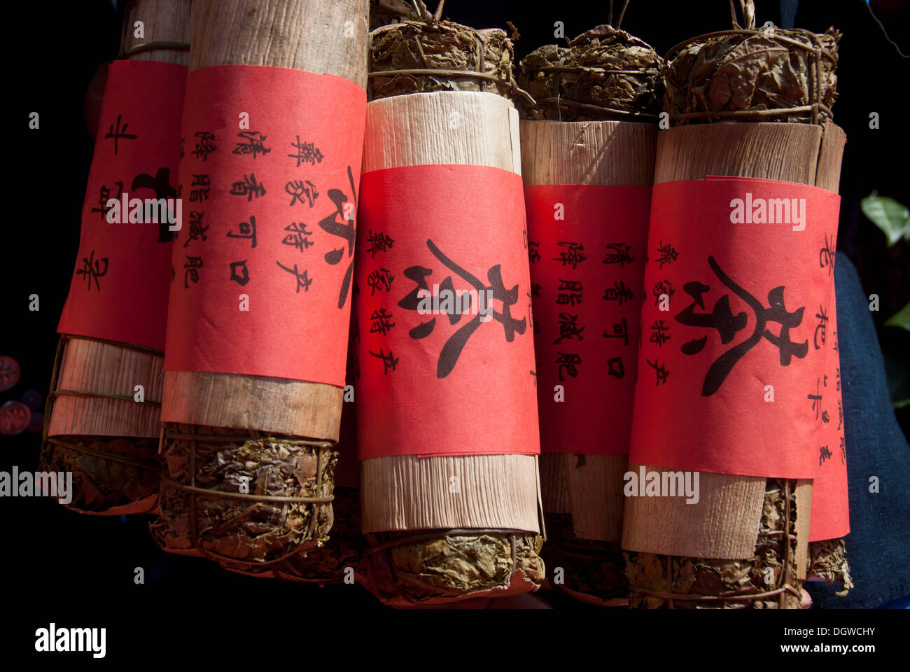 Green tea, compressed tea leaves wrapped in a red band with Chinese ...
