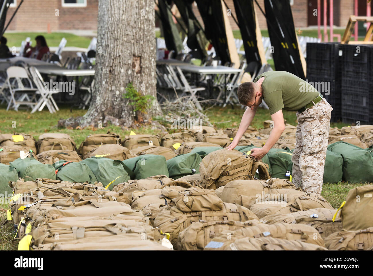 MARINE CORPS BASE CAMP LEJEUNE, N.C.- A Marines helps organize and ...