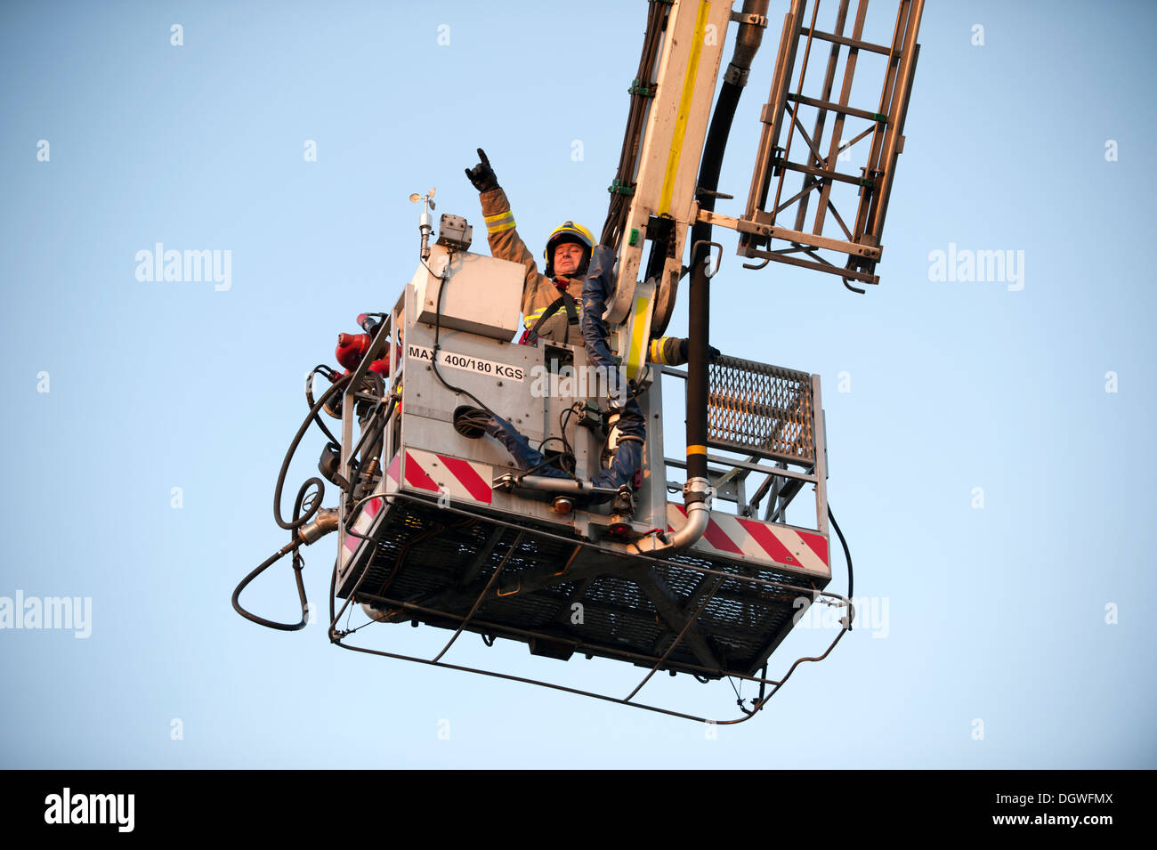 Firefighter pointing from cage of Hydraulic Platform Stock Photo - Alamy