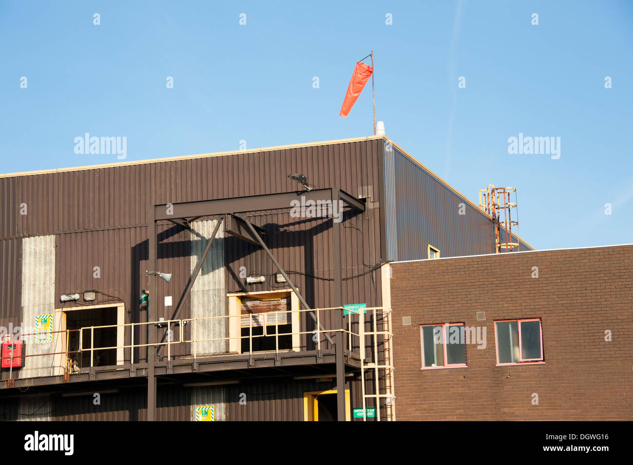 Wind Sock on roof of Chemical Factory Cloudburst Stock Photo - Alamy
