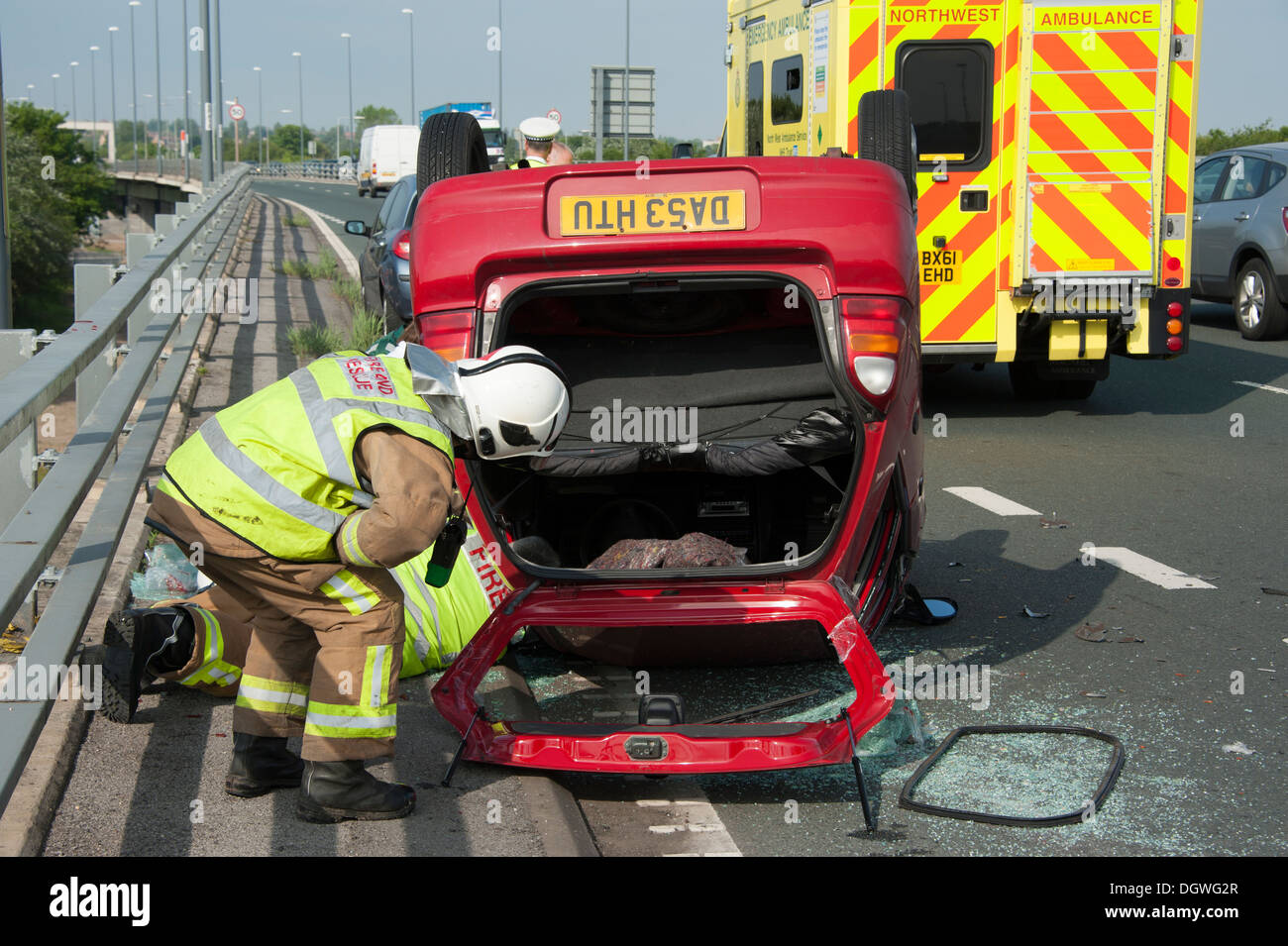 Car crash on roof overturned RTA RTC Fire Service Stock Photo - Alamy