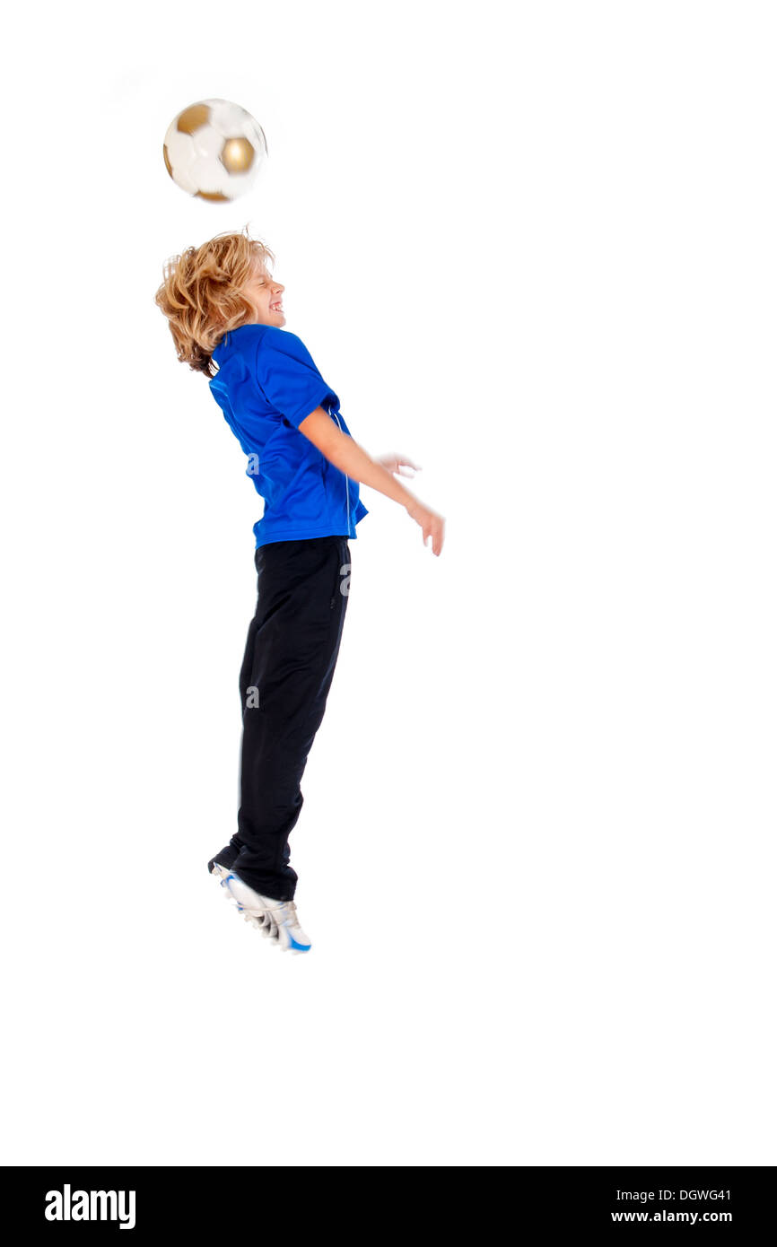 Child heading the ball hi-res stock photography and images - Alamy
