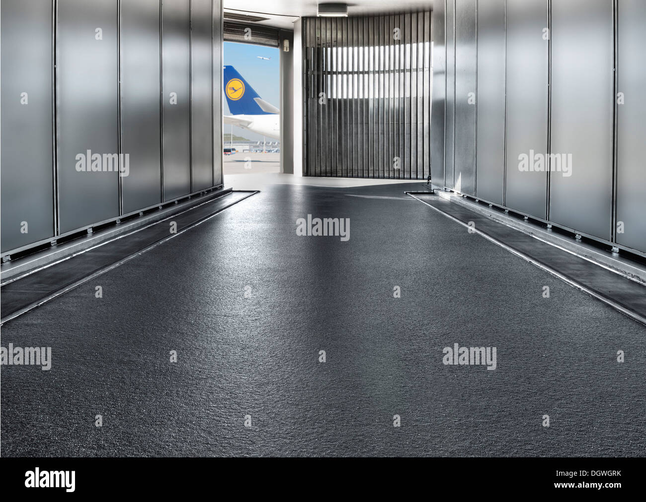 Airbridge or jetway, with the tail unit of a Lufthansa jet Stock Photo ...