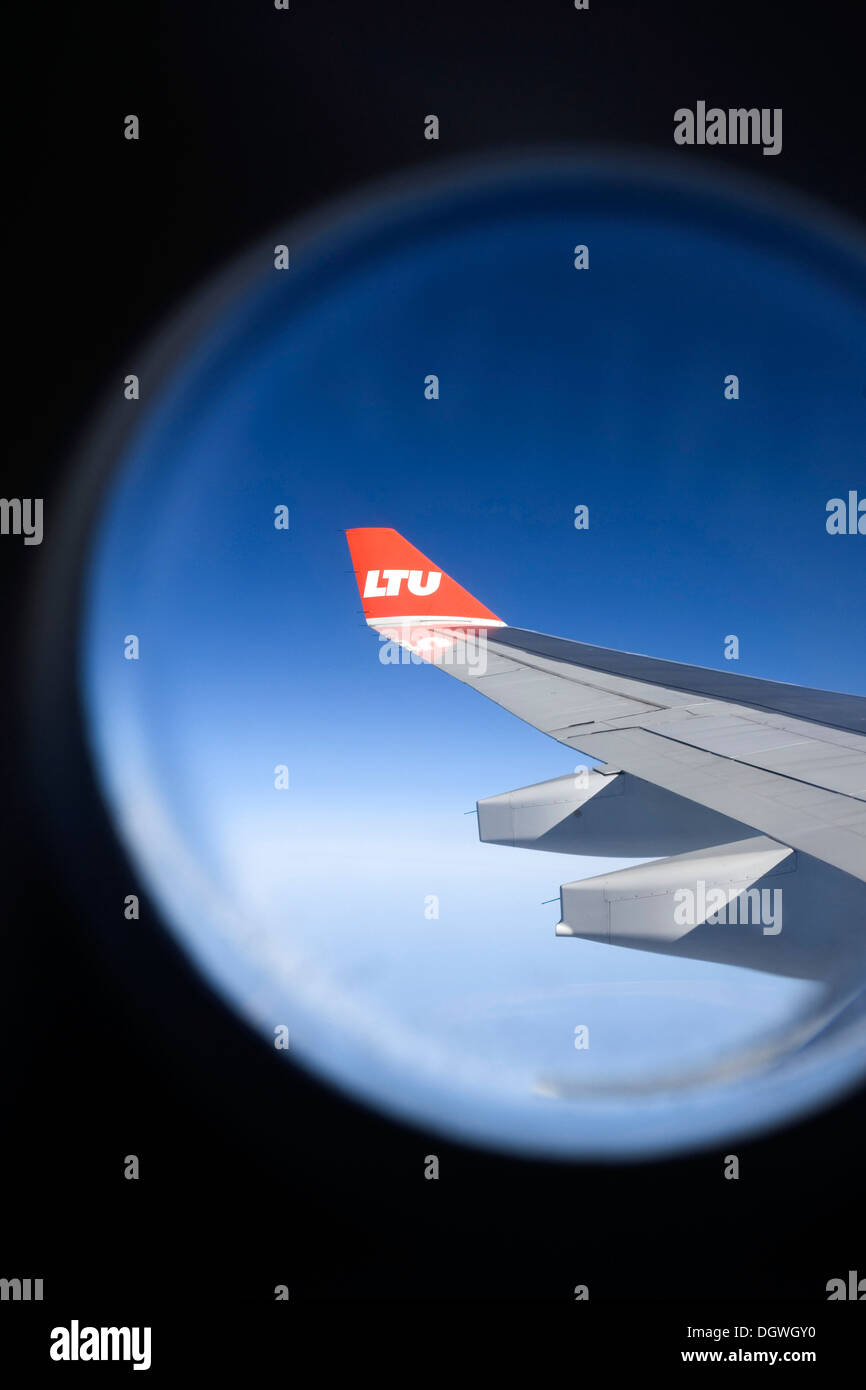 View from the cabin window to the wing of an Airbus aircraft in flight ...