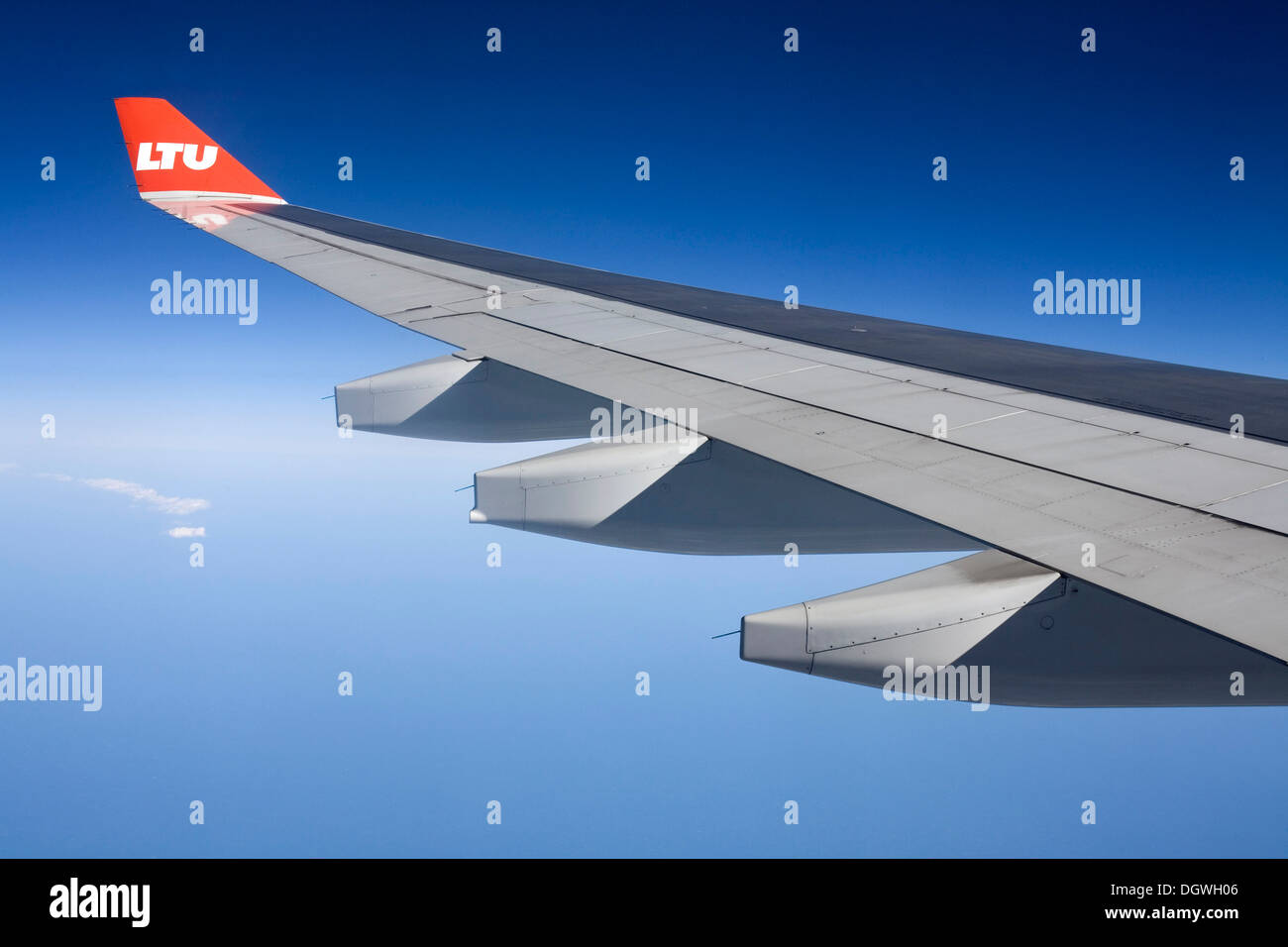 Wing of an Airbus aircraft in flight, with winglet and the logo of ...