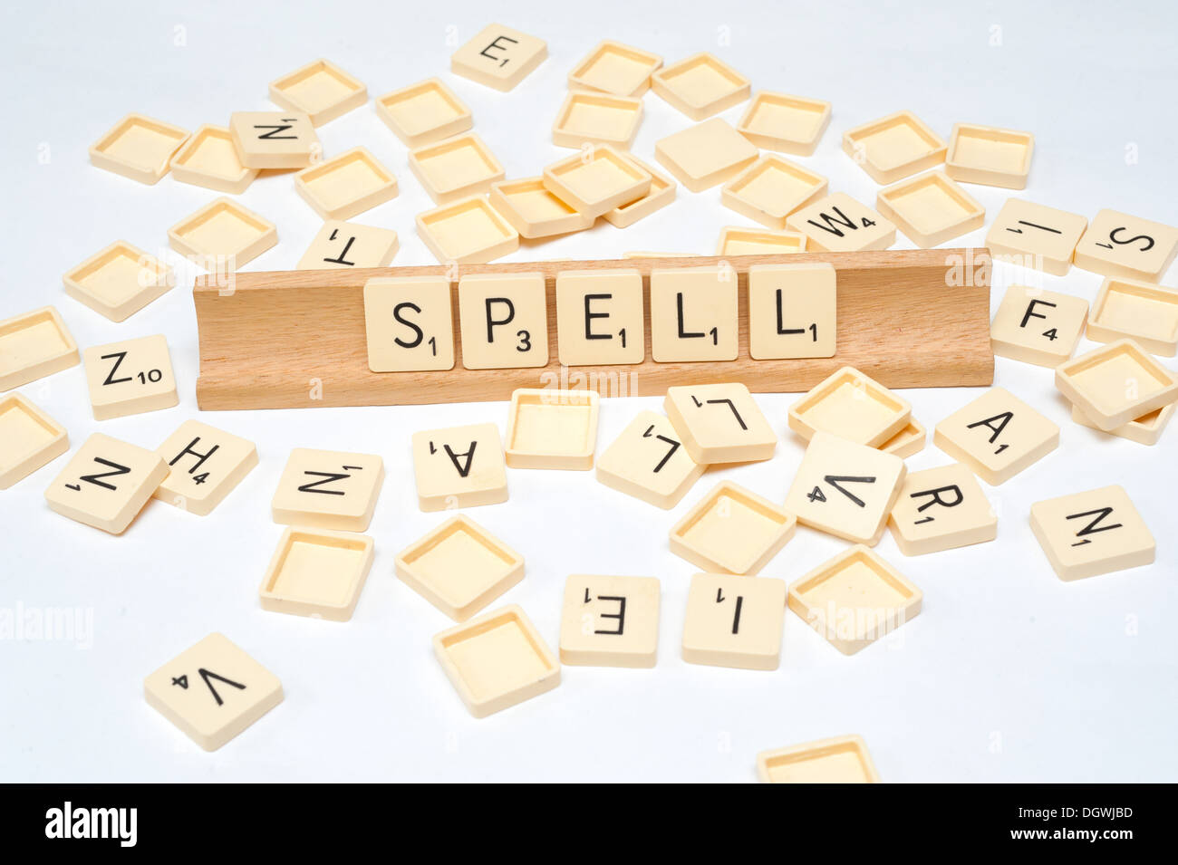 'Spell' written in scrabble tiles Stock Photo - Alamy