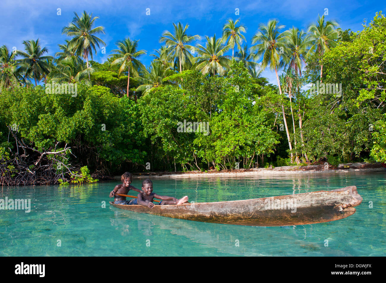 Local boys in a canoe in the Marovo Lagoon, Marovo Lagoon, Western ...
