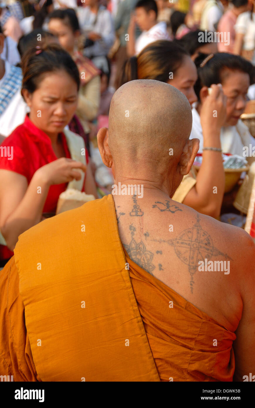 Theravada Buddhism, That Luang Festival, Tak Bat, tattoos, monk with ...