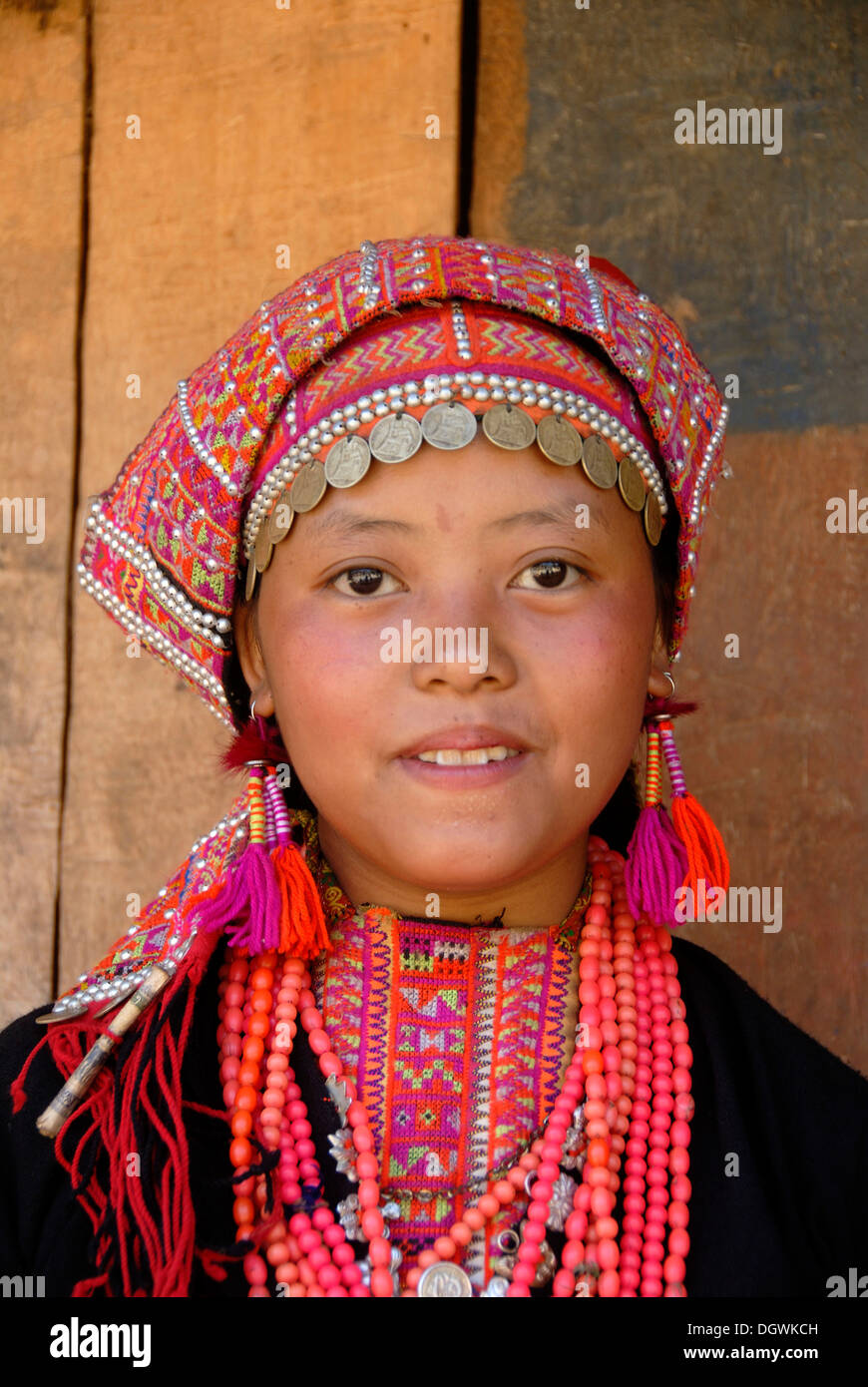 Portrait, smiling girl of the Akha Pala ethnicity, dress, traditional ...