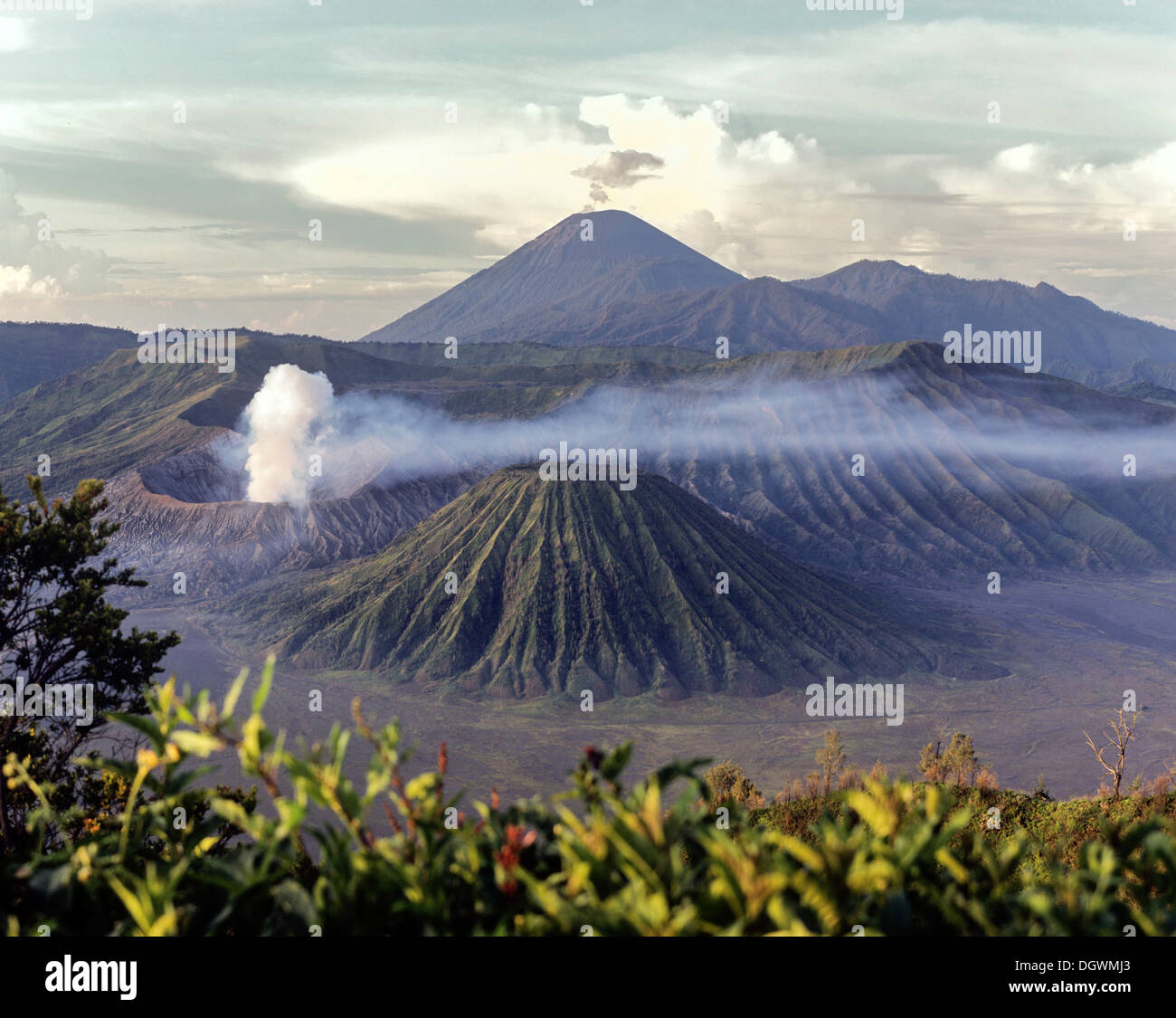 Mount Bromo with smoke, Mount Batok at front, Mt Kursi and Mt Gunung ...