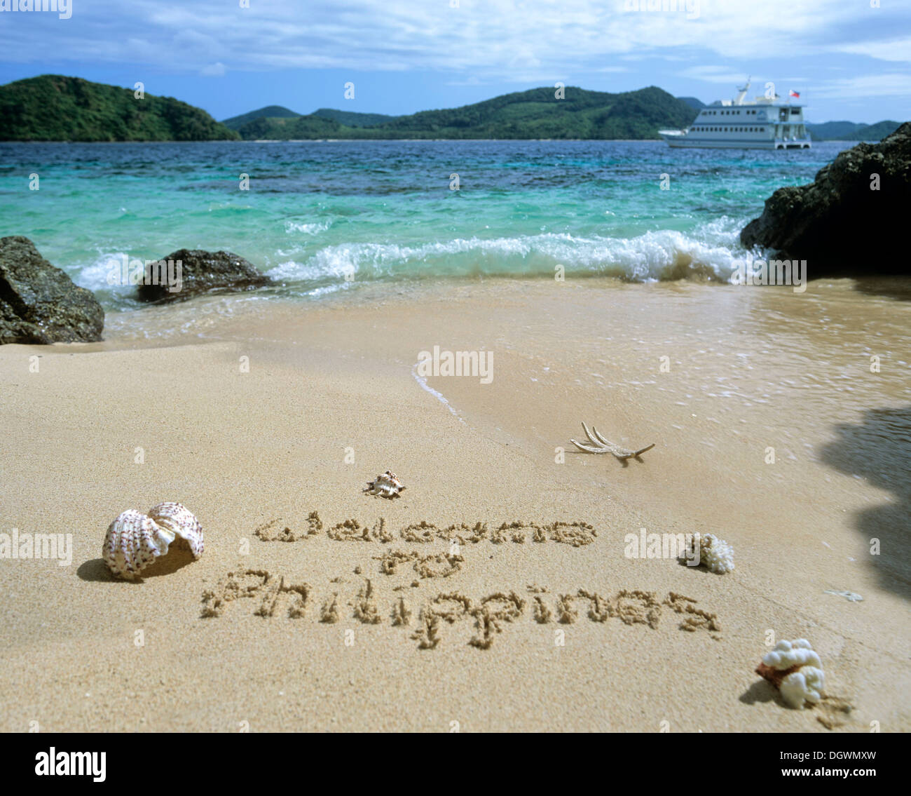 "Welcome to Philippines," welcome message written in the sand, sea ...