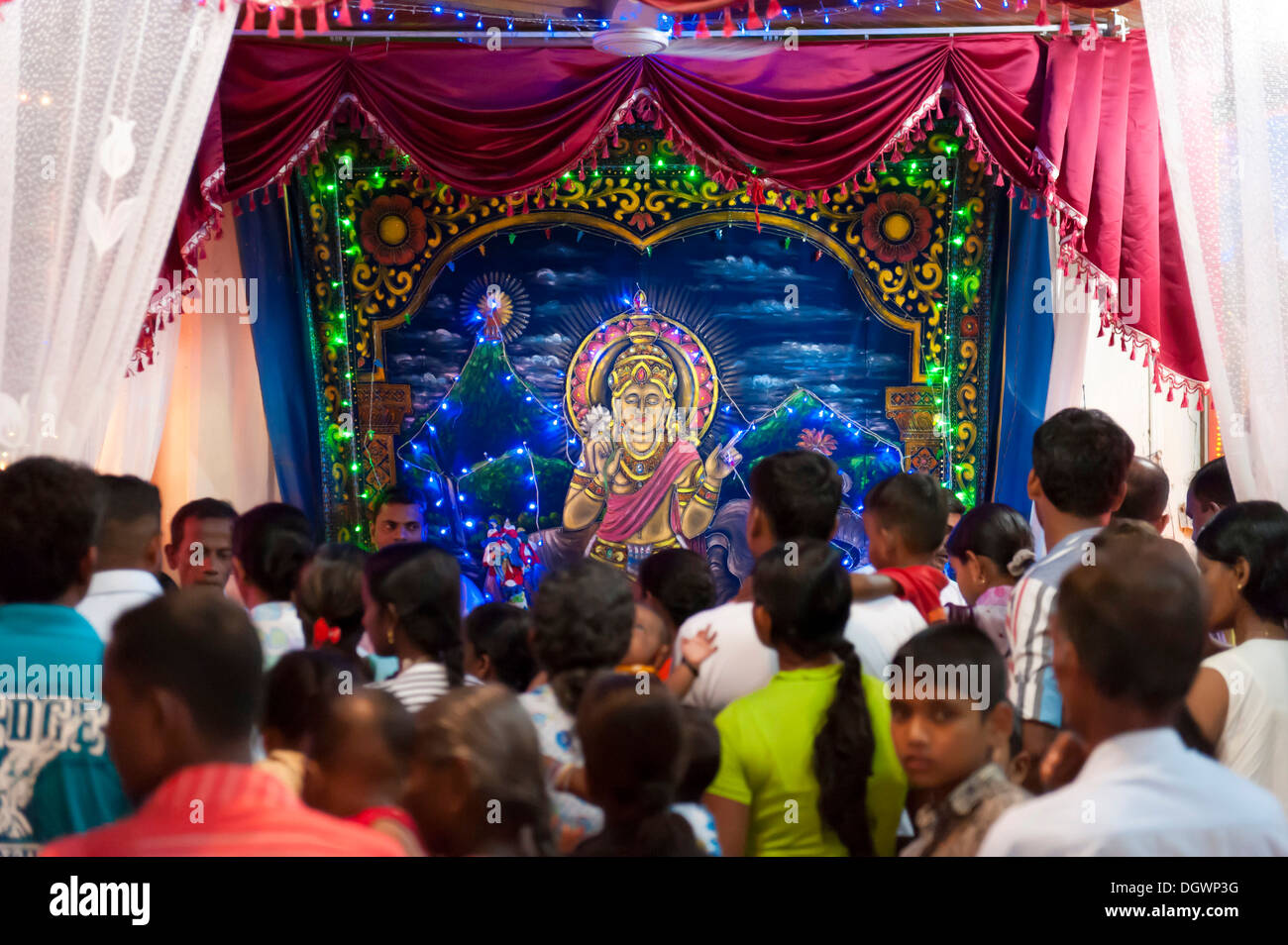 Worshipping Hindus, Hindu shrine with an image of the deity Saman in ...