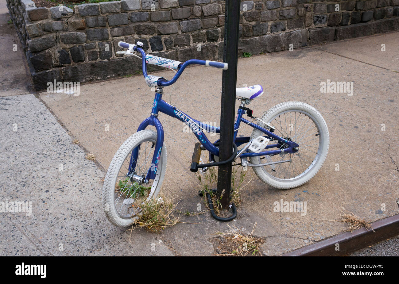 A female child's bike on the sidewalk in New York City Stock Photo - Alamy