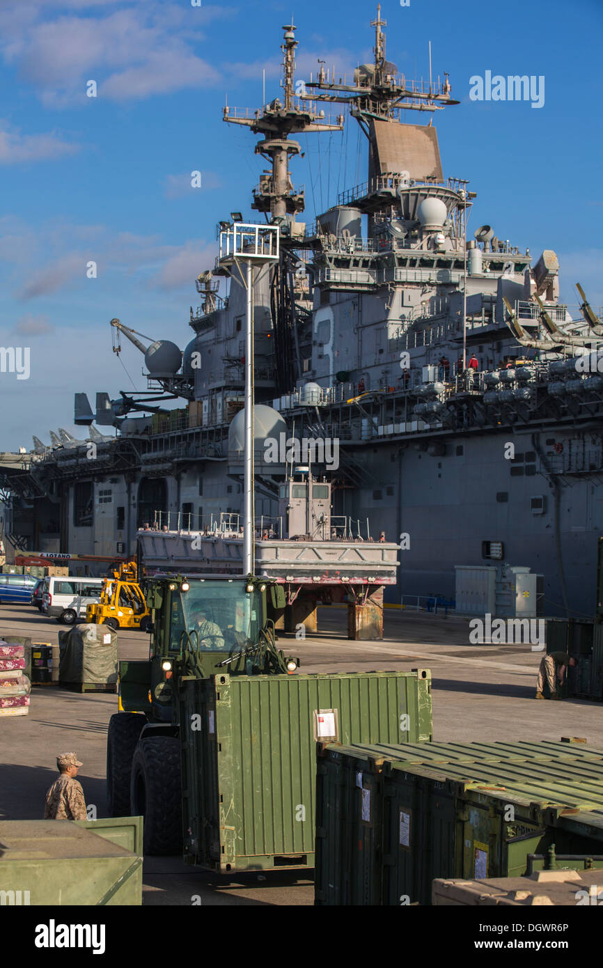 Shipping containers are transported after being inspected by U.S ...