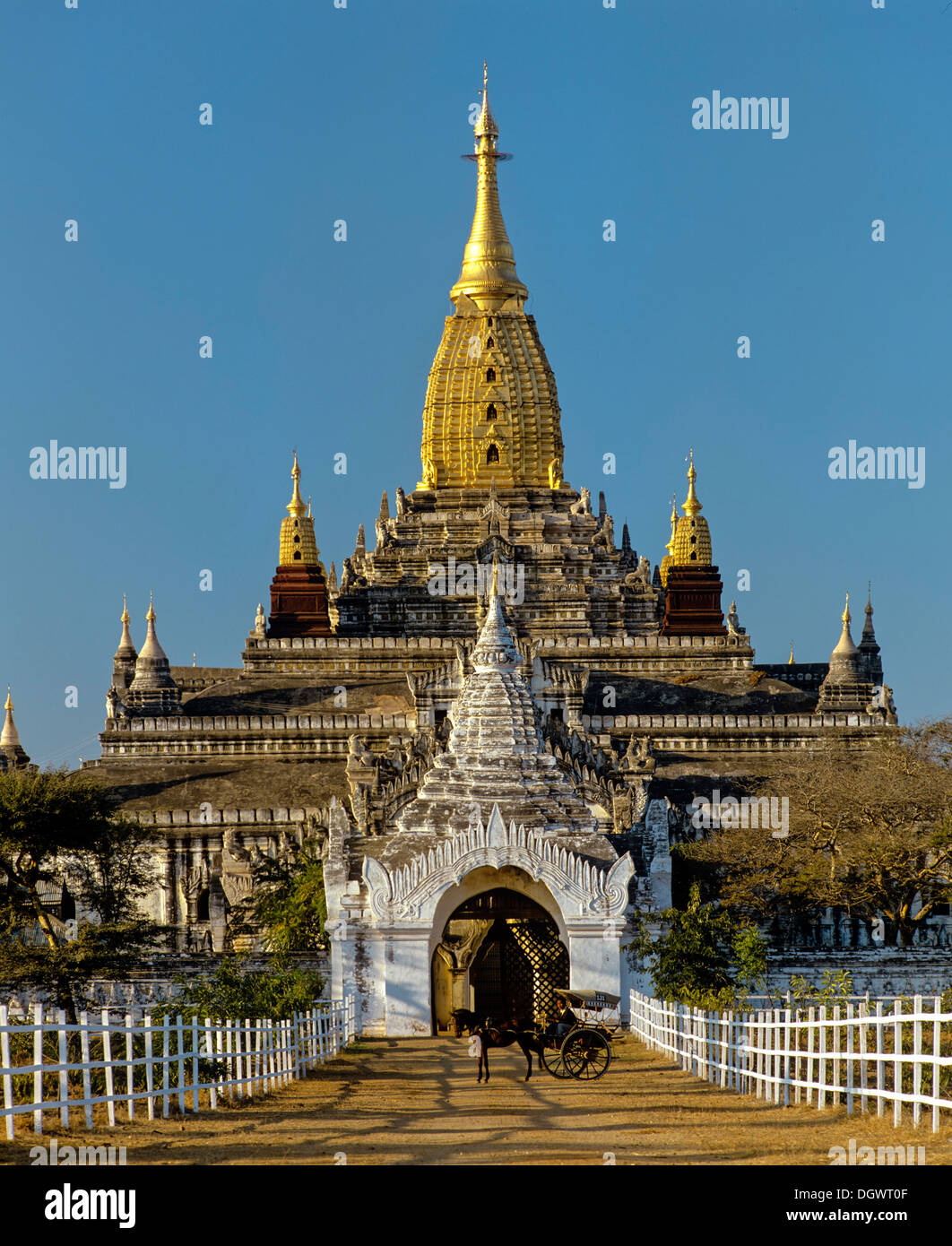 Horse-drawn carriage in front of Ananda Temple, gilded tower ...
