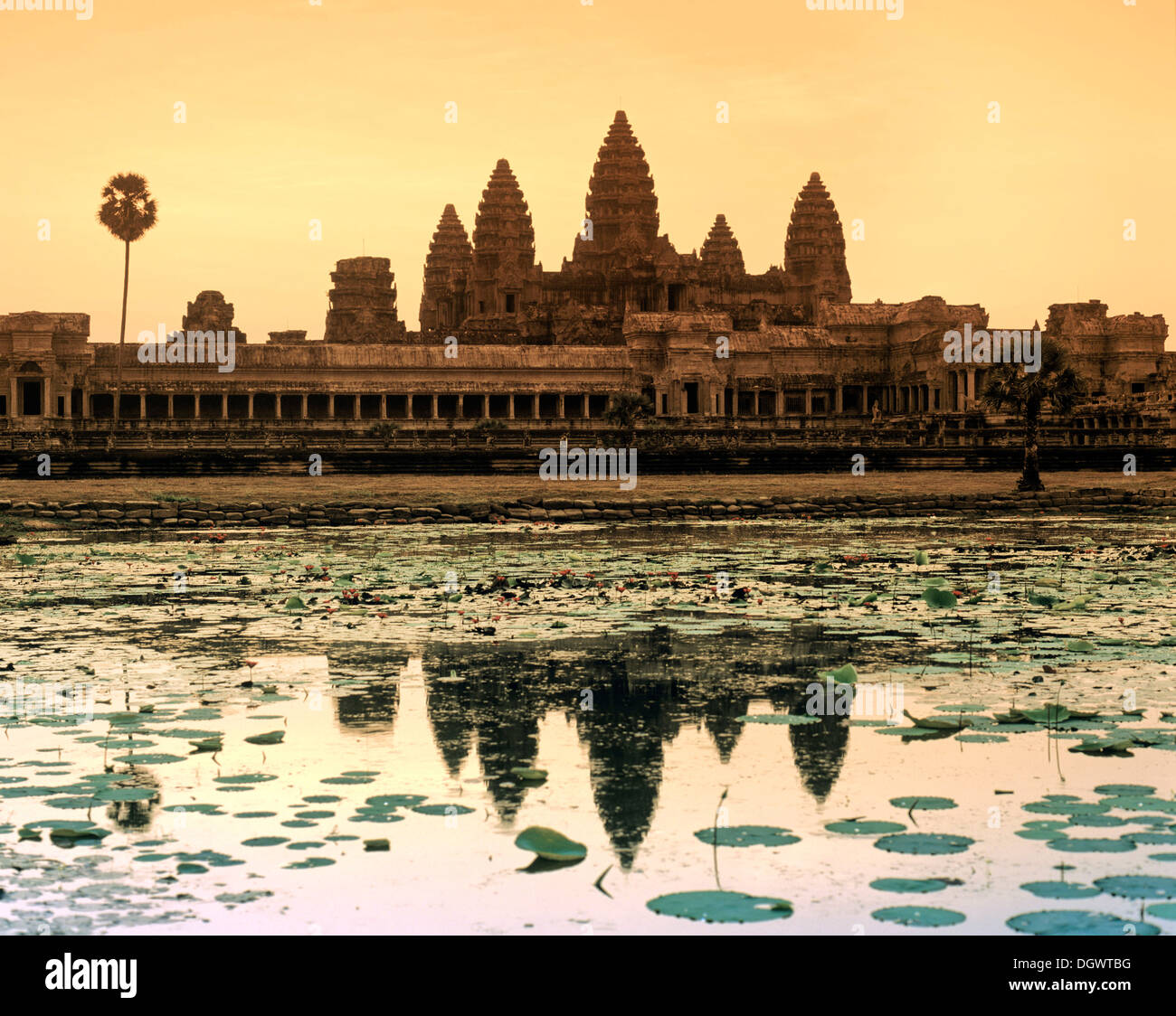Sunrise at the temple of Angkor Wat, main temple reflected in the lotus ...