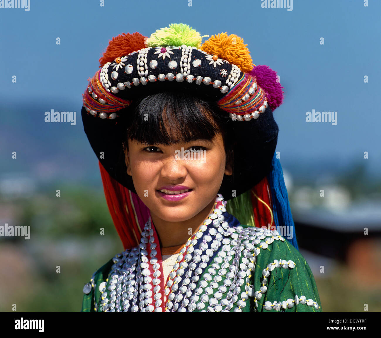 Lisu girl wearing a colourful headdress and the traditional costume of ...