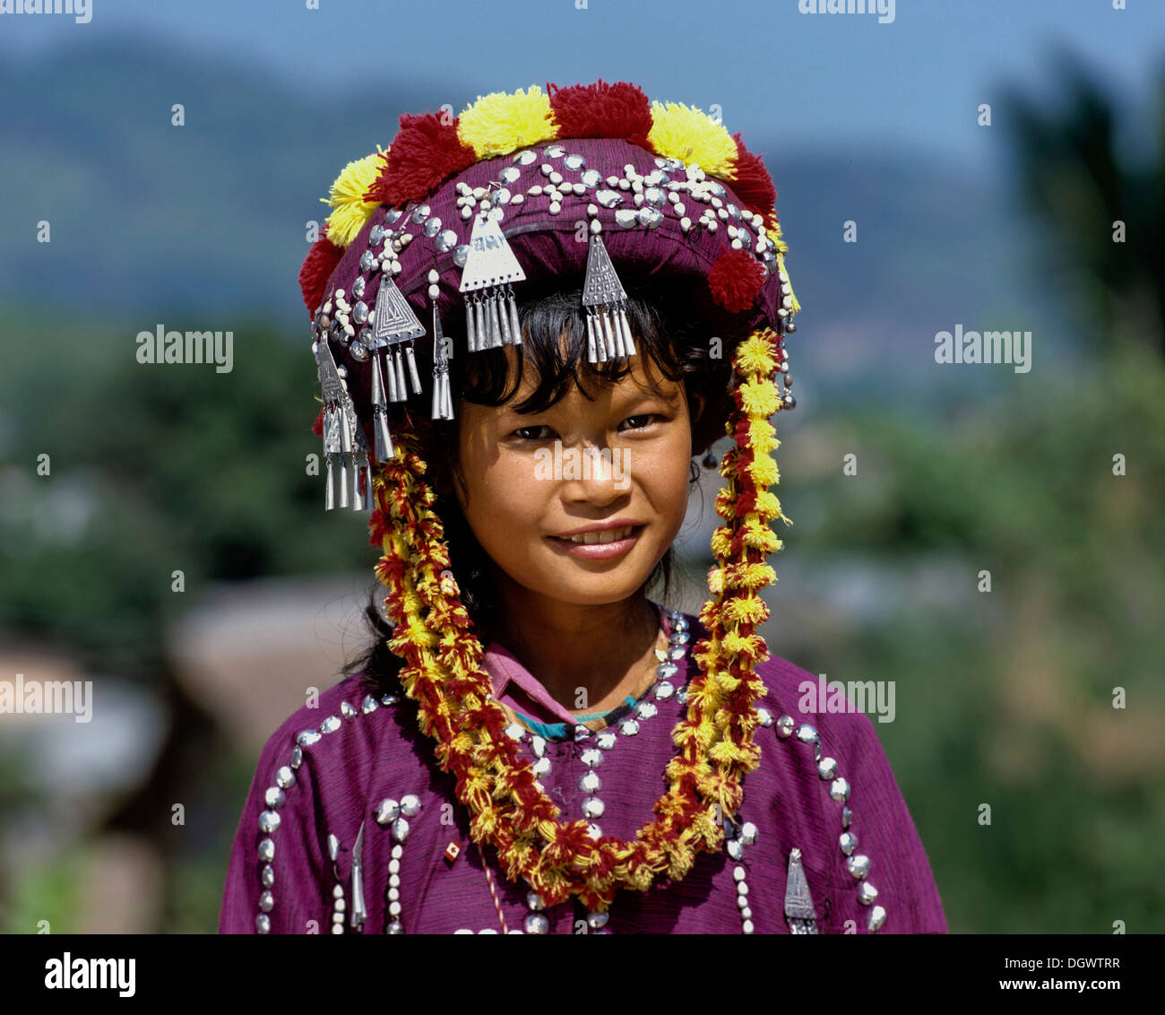 Lisu girl wearing a colourful headdress and the traditional costume of ...