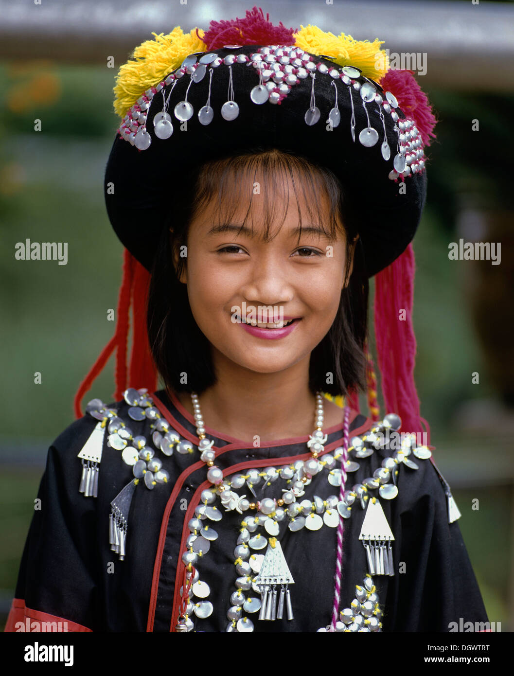 Lisu girl wearing a colourful headdress and the traditional costume of ...