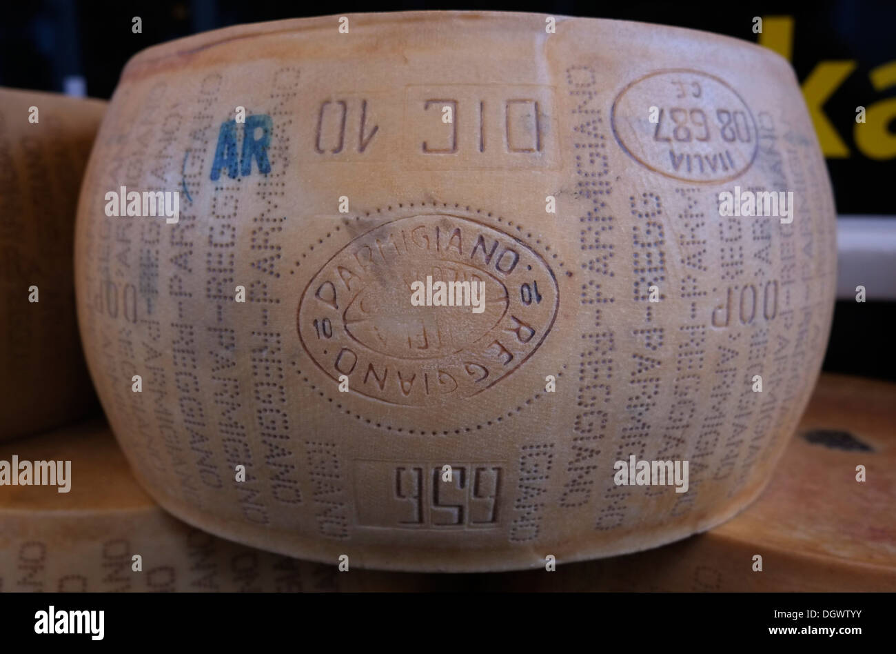 A wheel of Parmigiano Reggiano cheese or Parmesan cheese for sale in a ...