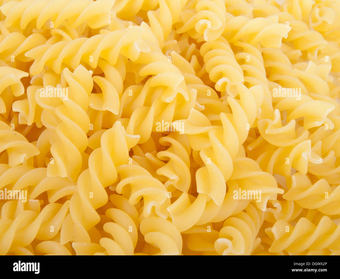 raw yellow fusilli - Italian pasta Stock Photo - Alamy