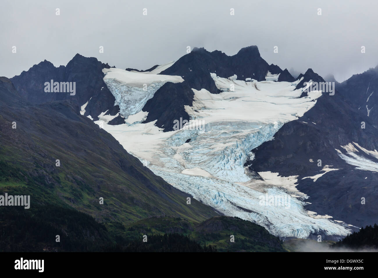 Glaciers high in the mountains in Alaska deep blue color Stock Photo ...