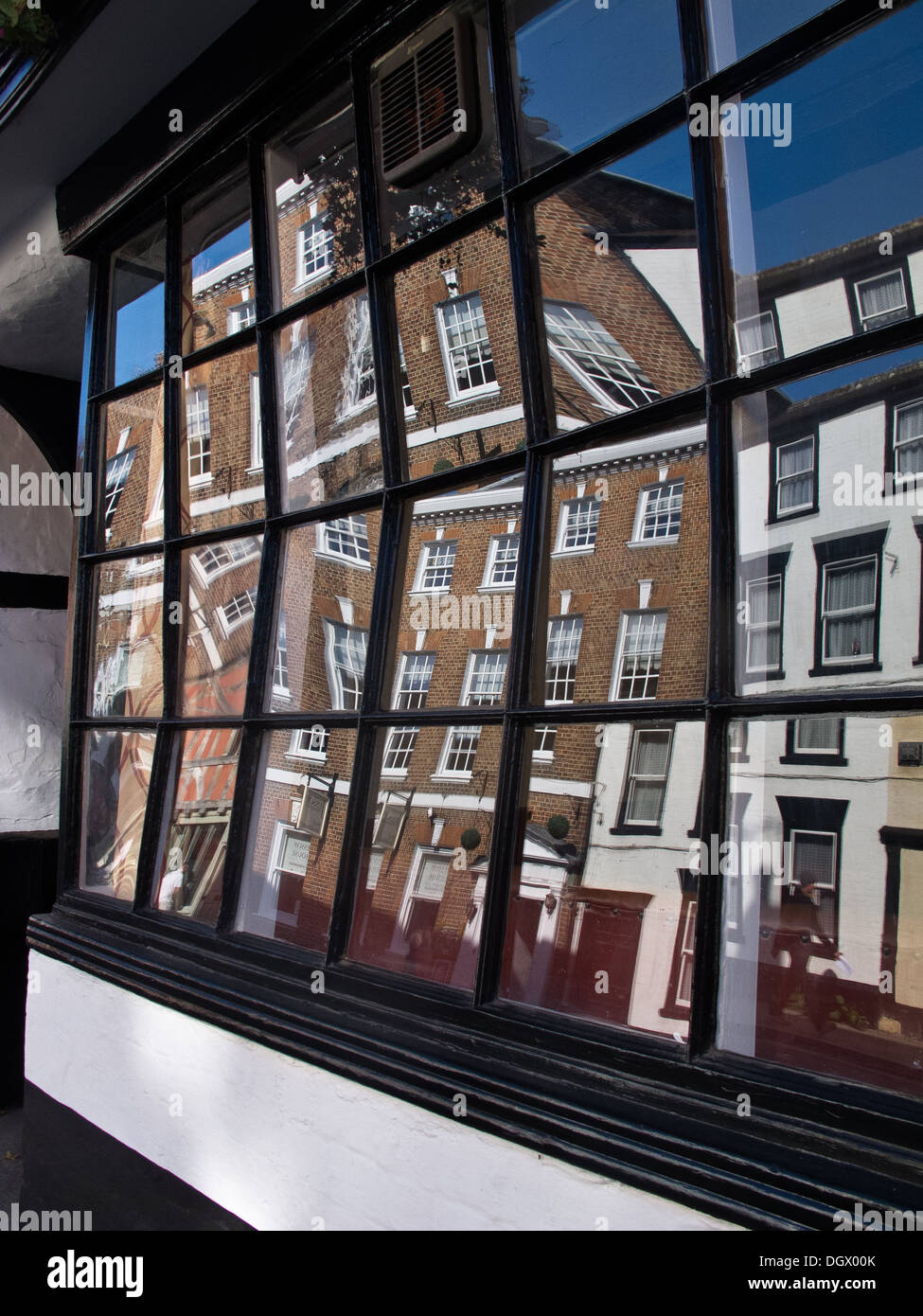 Reflections in old shop window Stock Photo - Alamy
