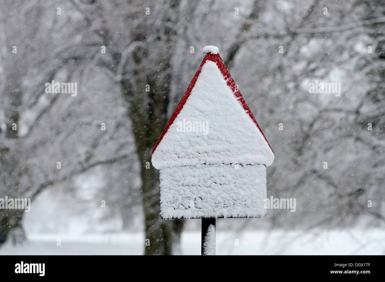 Snow covered warning sign Stock Photo - Alamy