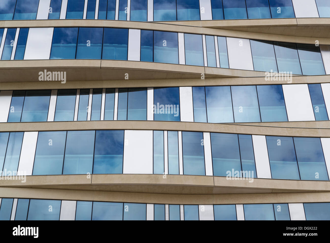 Tiered cladding facade reflecting the clouds behind Stock Photo - Alamy
