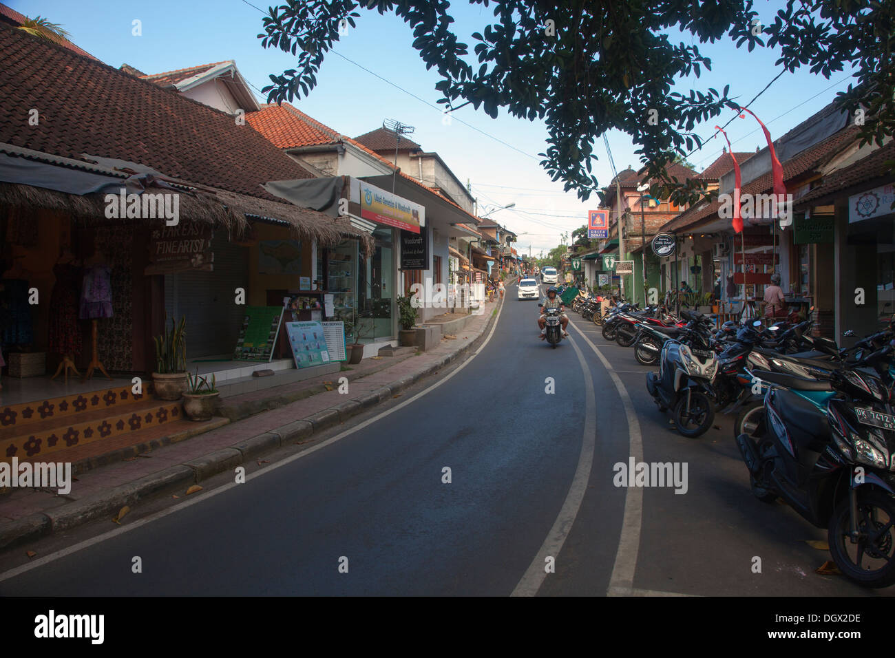 street scene Ubud Bali Indonesia traffic bikes car congestion movement ...