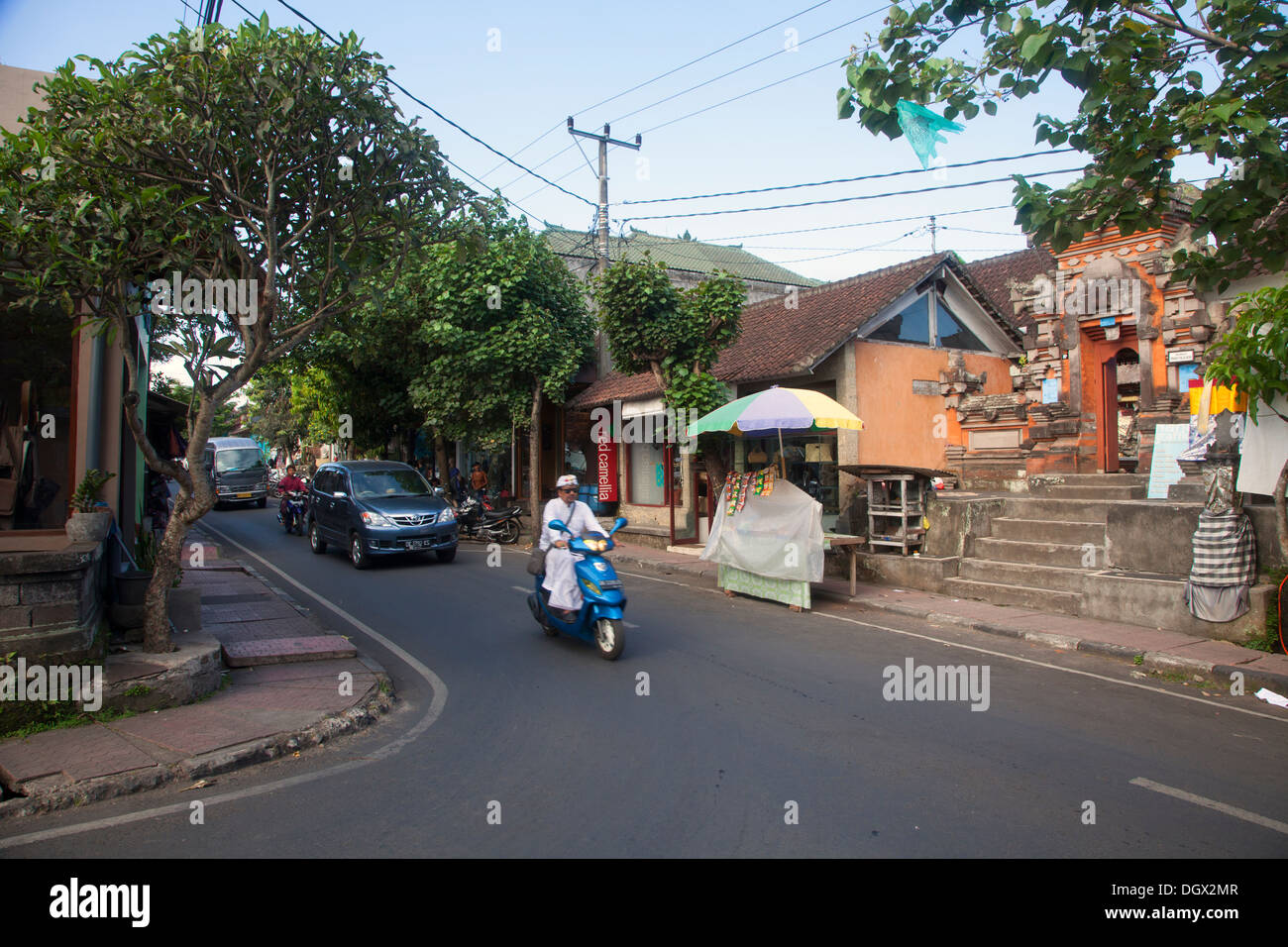 street scene Ubud Bali Indonesia traffic bikes car congestion movement ...